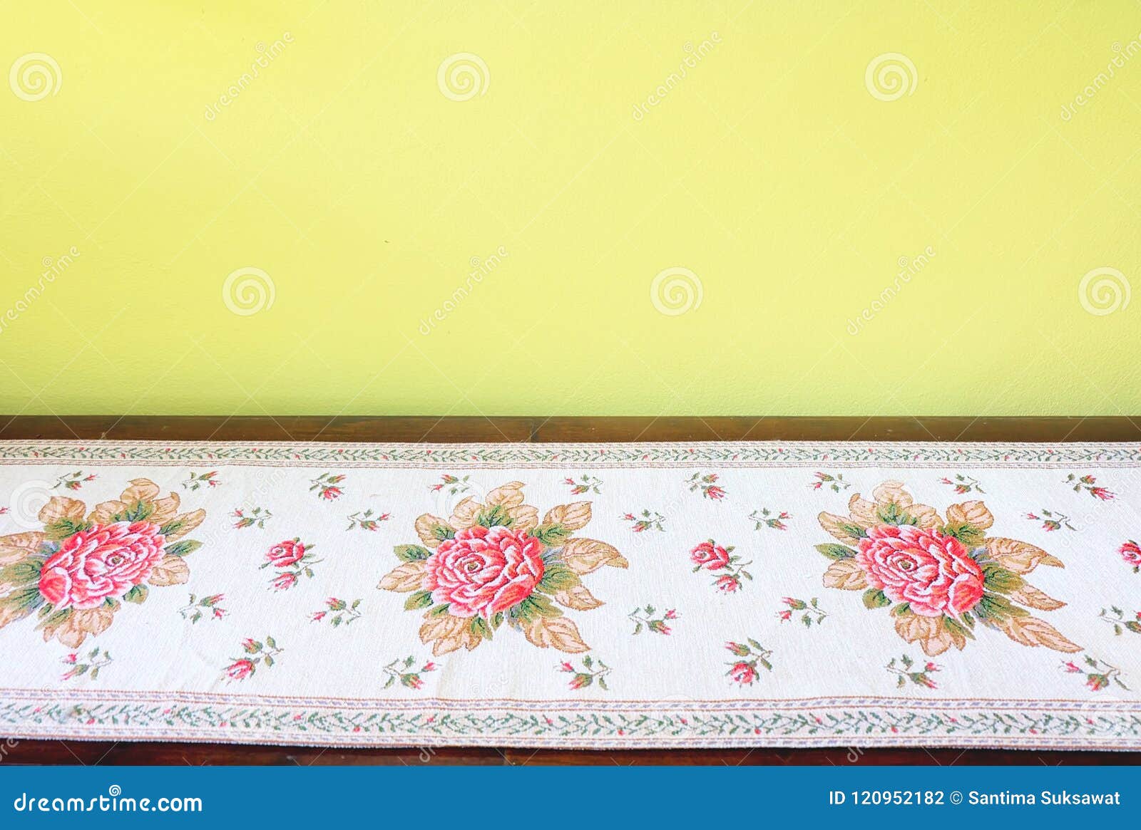 Retro Flower Tablecloth with Yellow Wall Background Stock Photo - Image ...