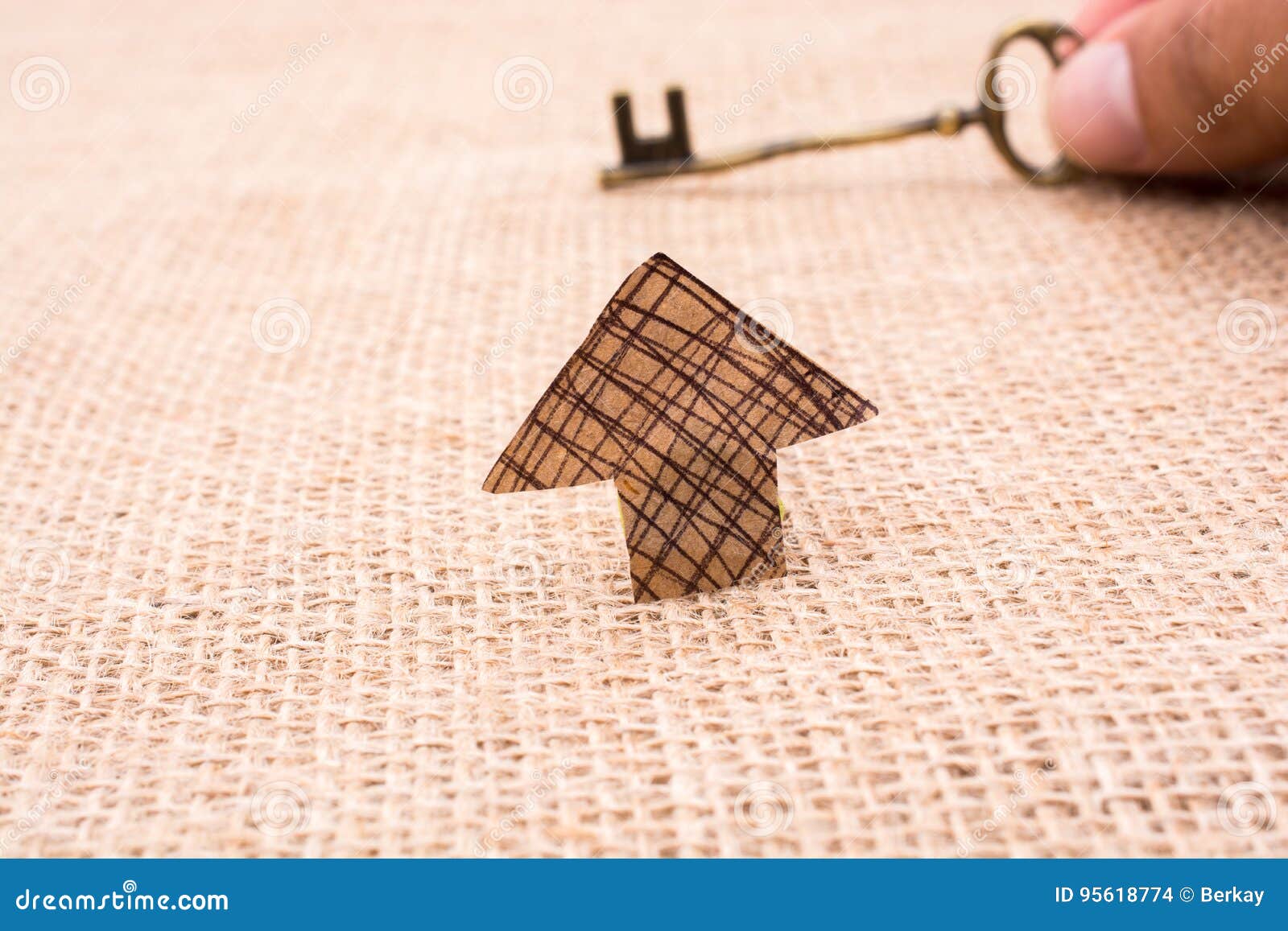 Retro Key and an Arrow Cut Out of Brown Paper Stock Photo - Image of ...