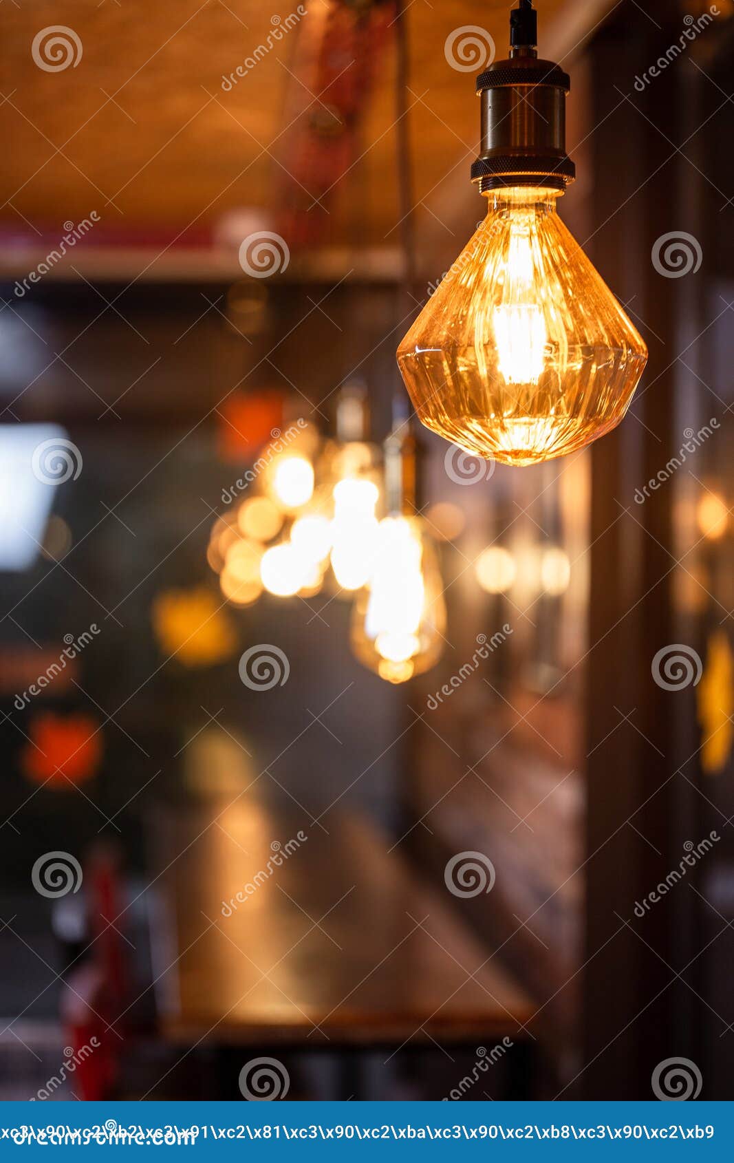 Retro Light Bulb with Warm Light in a Cafe Stock Image - Image of ...