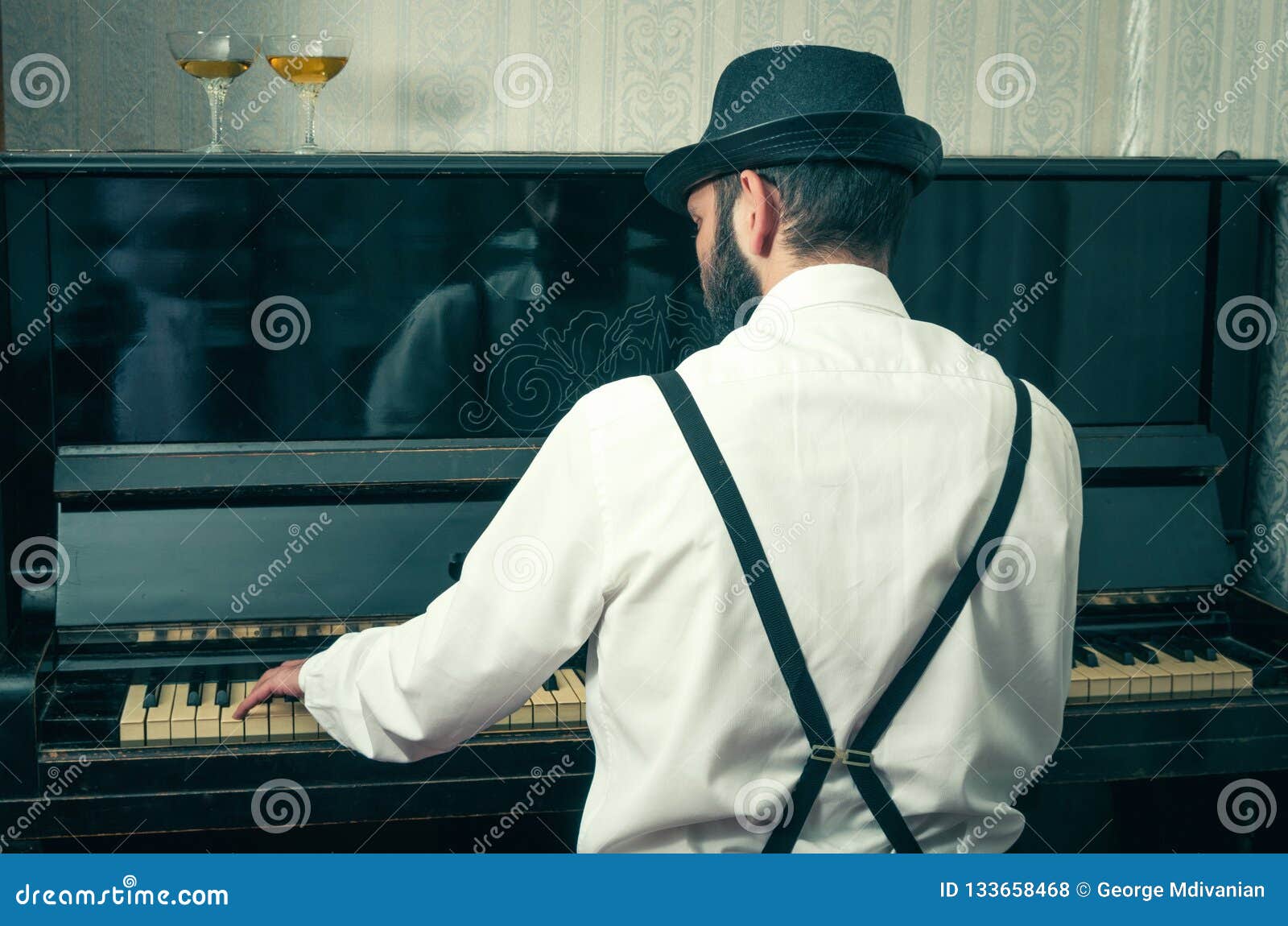 Man playing the piano stock photo. Image of keyboard - 133658468