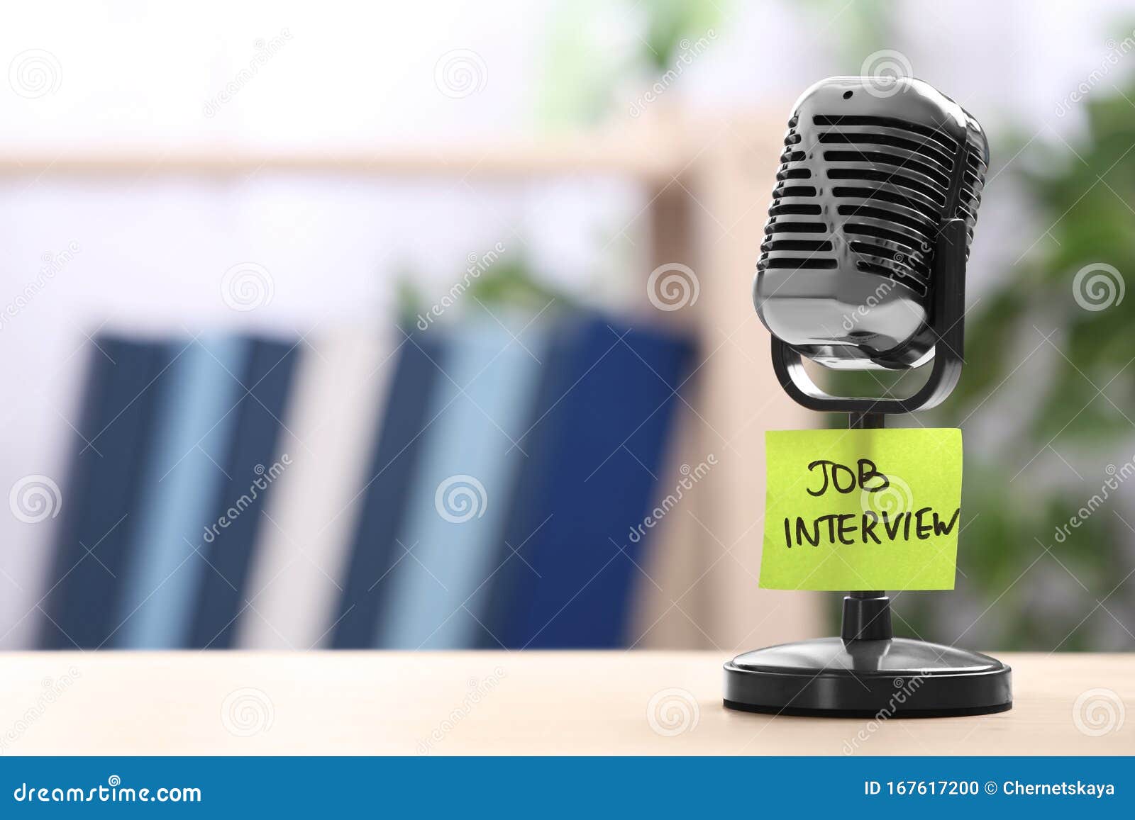 Retro Microphone and Reminder Note with Words JOB INTERVIEW on Table ...