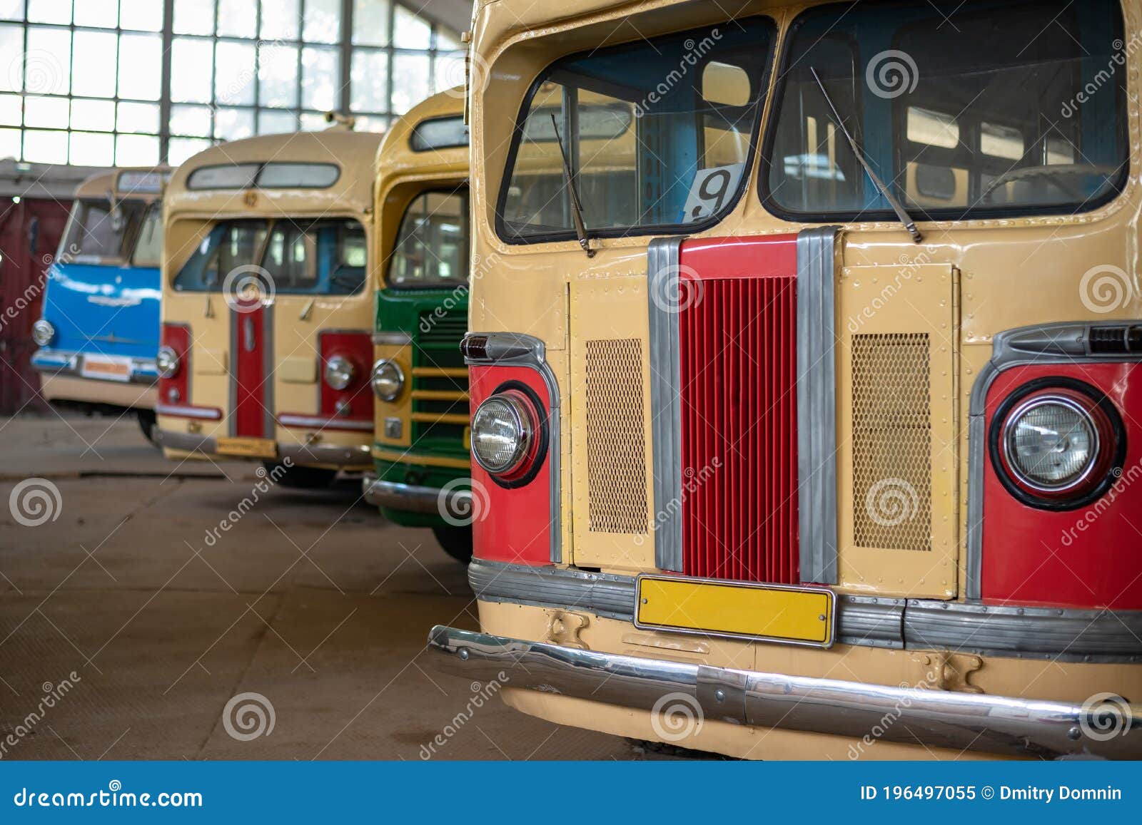 Retro Multi-colored Buses in a Large Garage Editorial Image - Image of ...