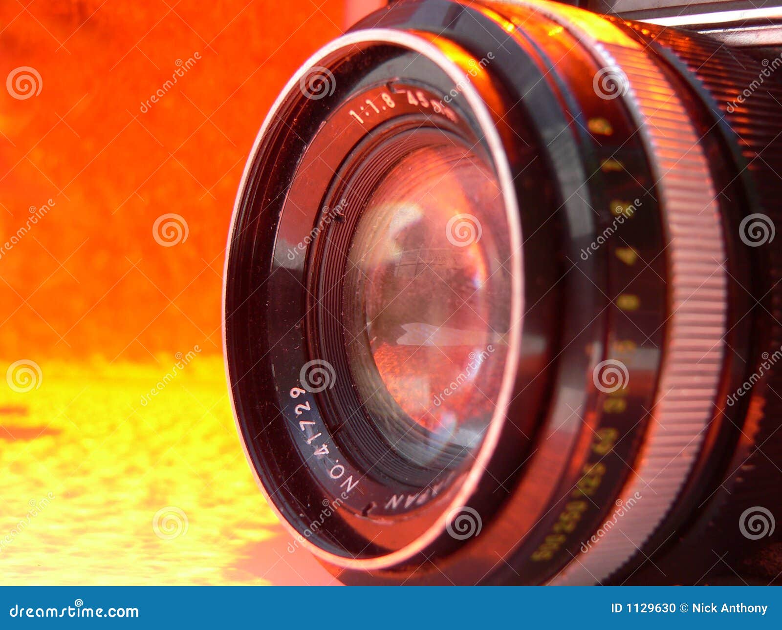 Retro Orange Camera Lens stock photo. Image of film, optical - 1129630
