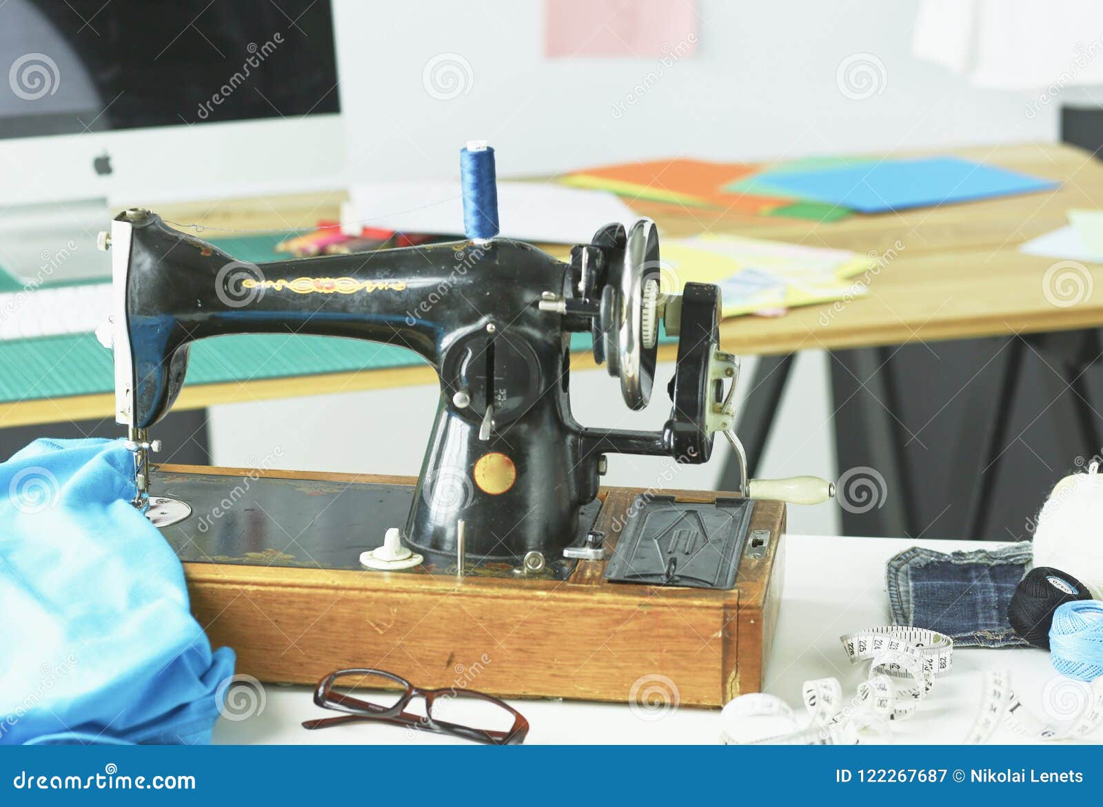Retro Sewing Machine on Designer Clothes Desktop Stock Image - Image of ...