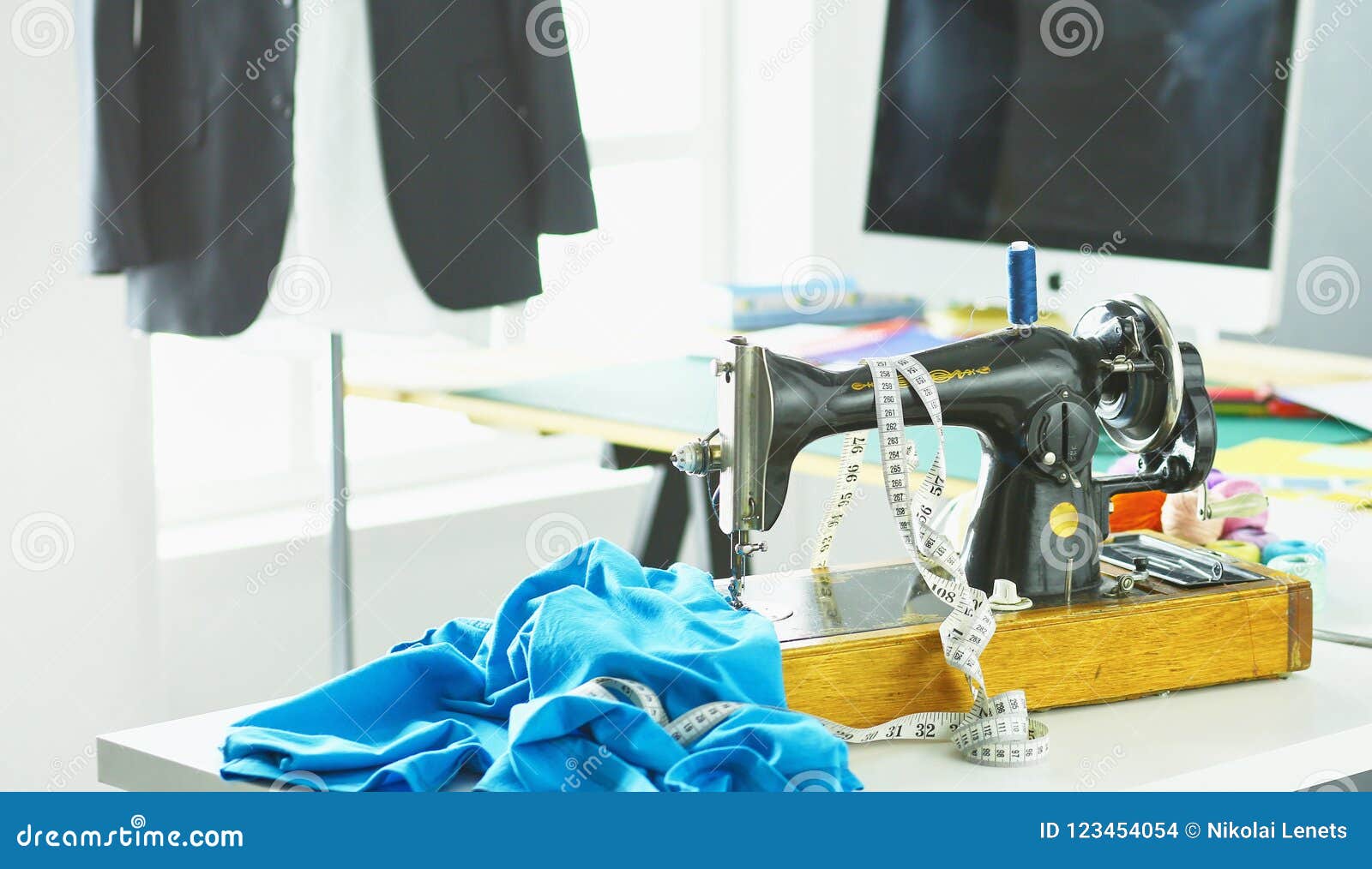 Retro Sewing Machine on Designer Clothes Desktop Stock Photo - Image of ...