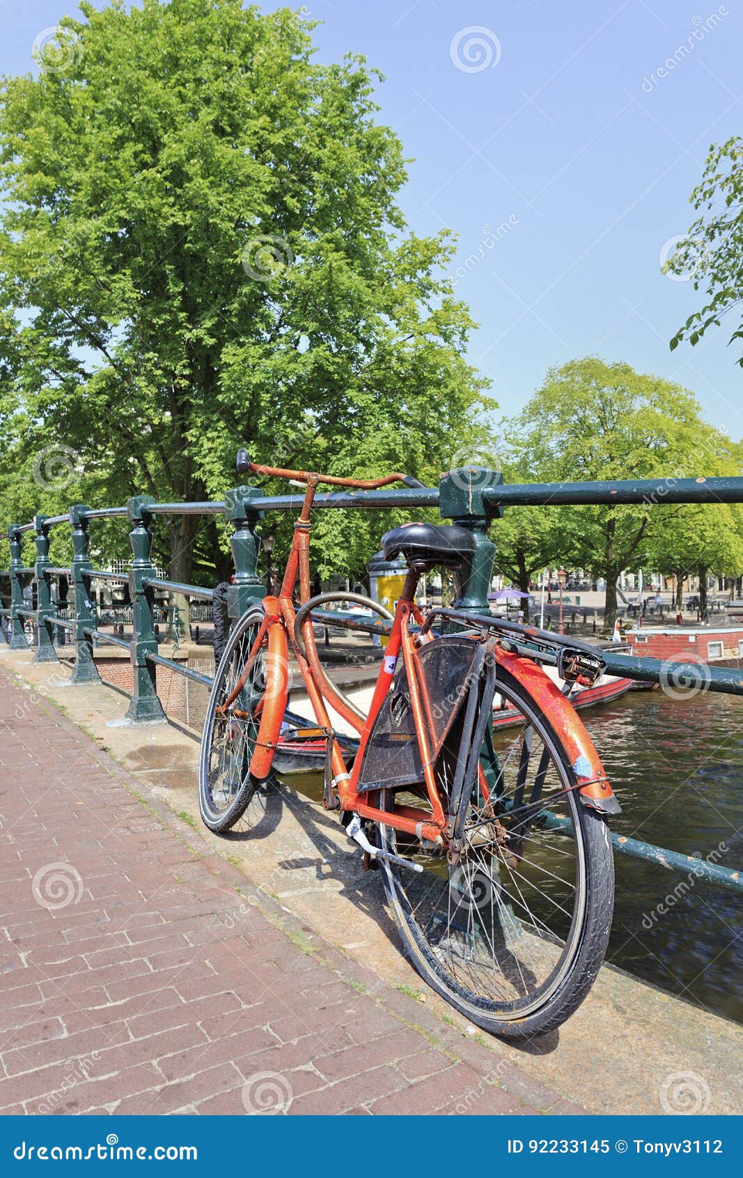 Retro Style Bicycle Locked on a Bridge Railing, Amsterdam, Netherlands ...