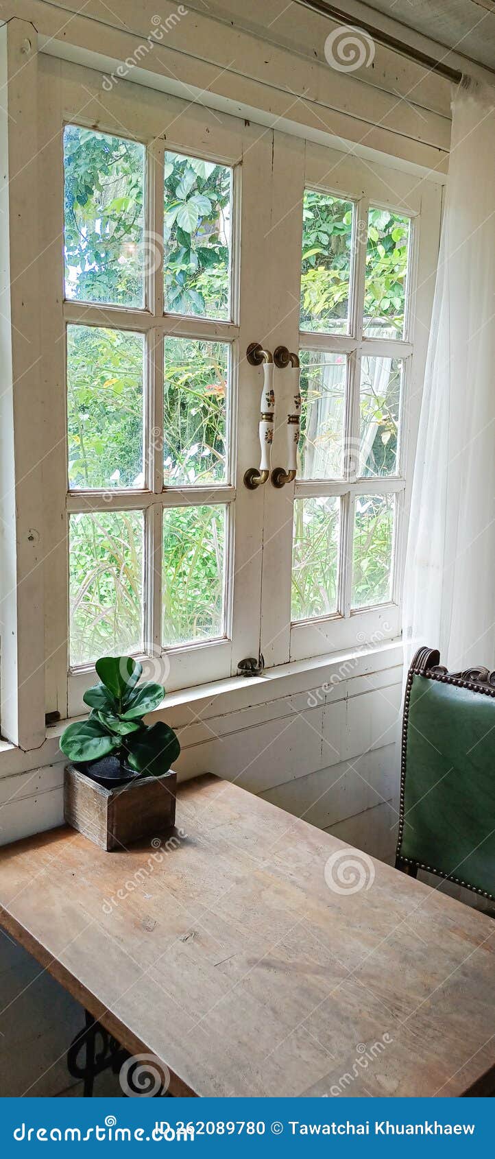 The Retro-style Window Overlooks the Trees and Shines with Light Stock ...