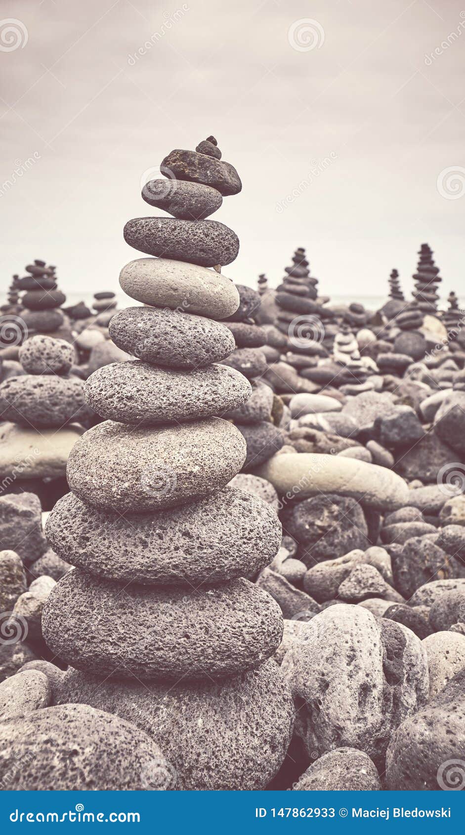 Retro Stylized Picture of a Volcanic Stones Stack on a Beach Stock ...