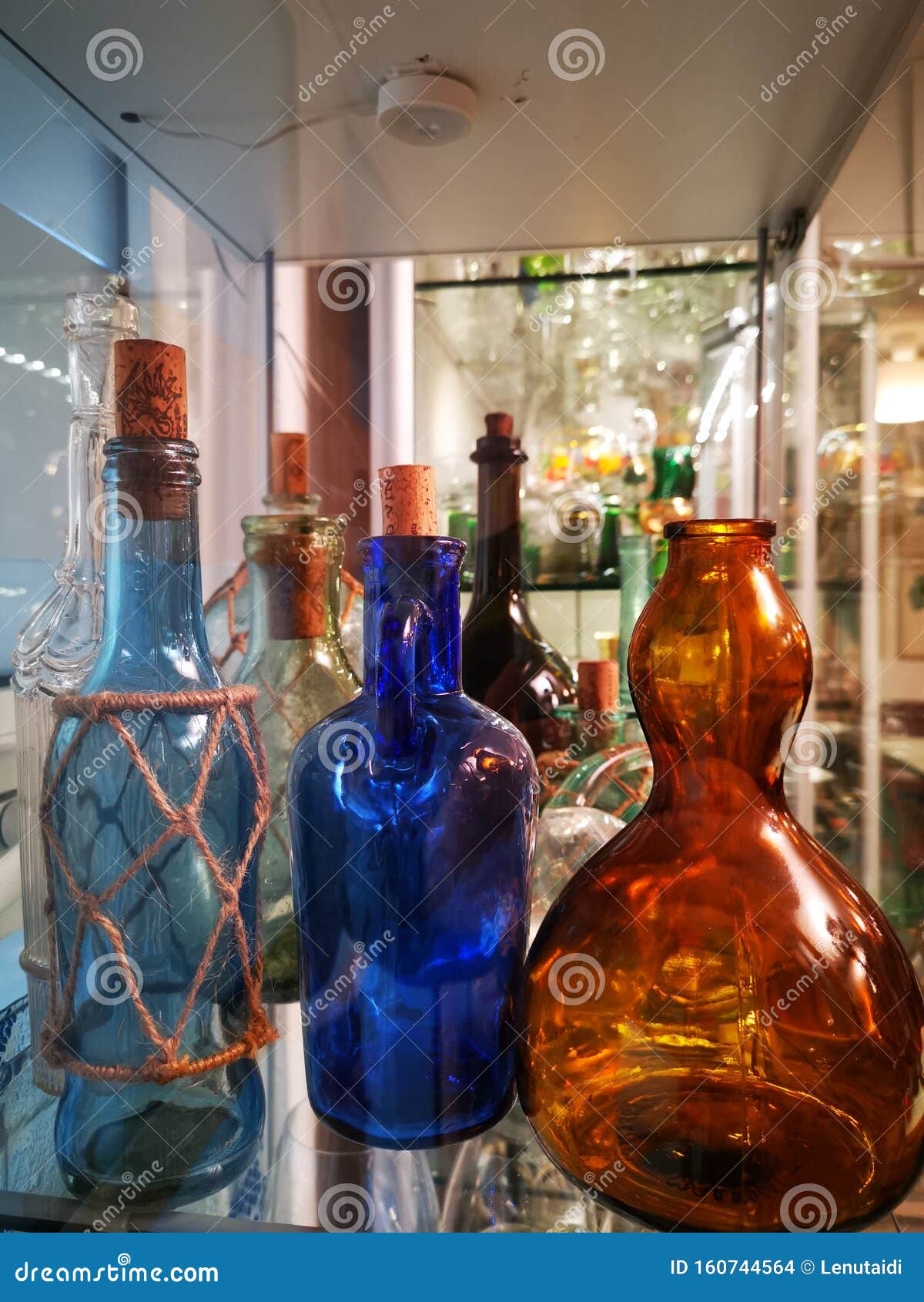 Retro Wine Bottles in a Showcase Stock Photo - Image of window, colors ...