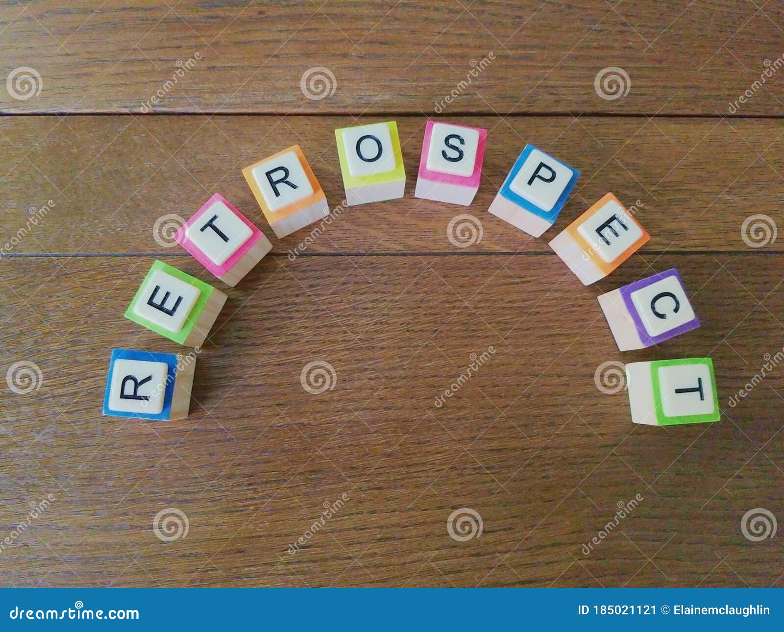 Retrospect in Colorful Letters on Wood Background Stock Image - Image ...