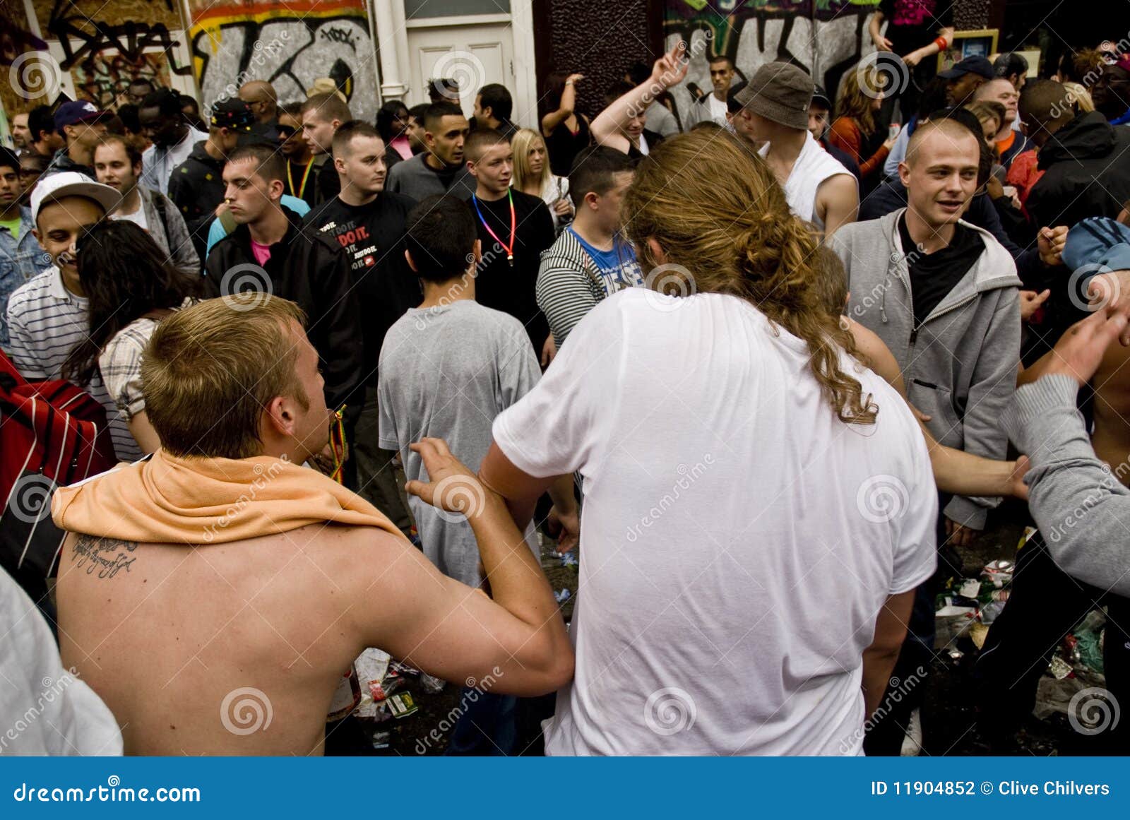 Revelers Dancing in the Street Editorial Photography - Image of guys ...