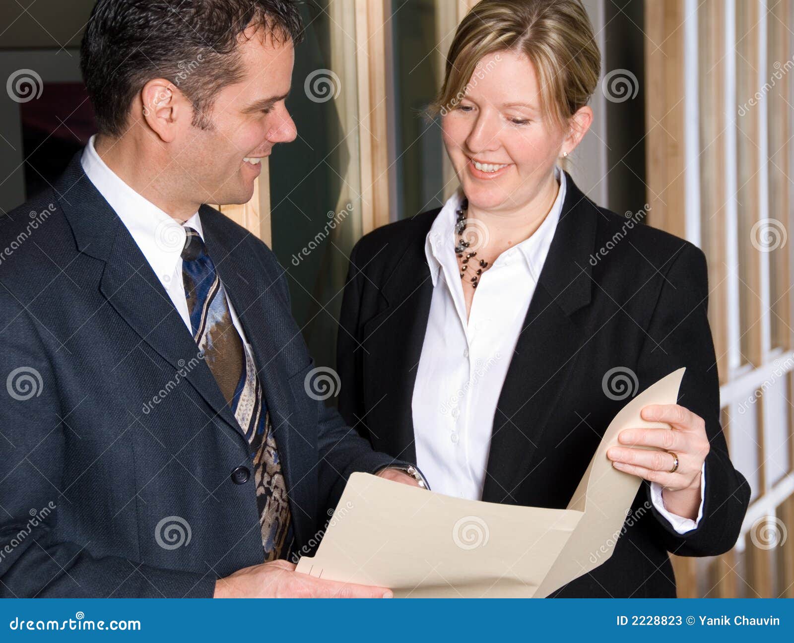 Reviewing files stock image. Image of colleagues, happy - 2228823