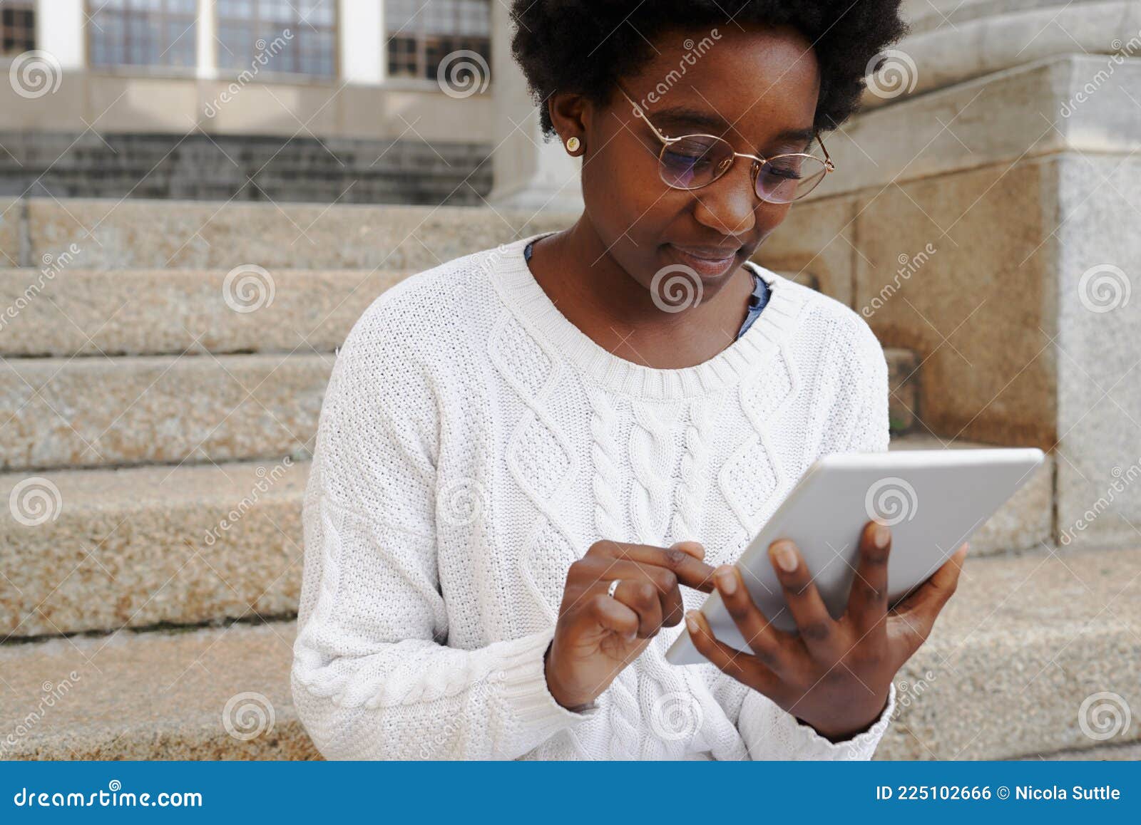 Reviewing Her Notes before Class Stock Photo - Image of steps ...