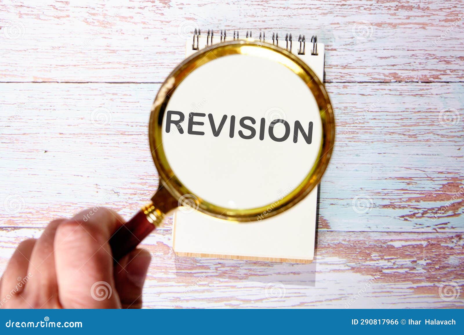 REVISION Text Seen through Magnifying Glasses on a Notepad Stock Photo ...
