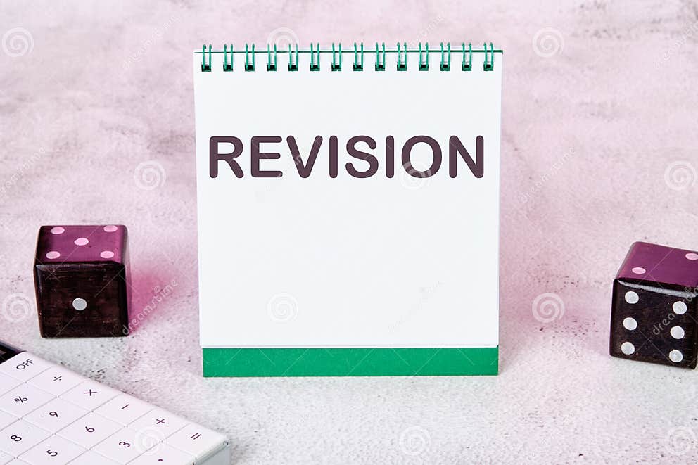 REVISION Text on a White Notepad Sheet Next To Dice on an Abstract ...