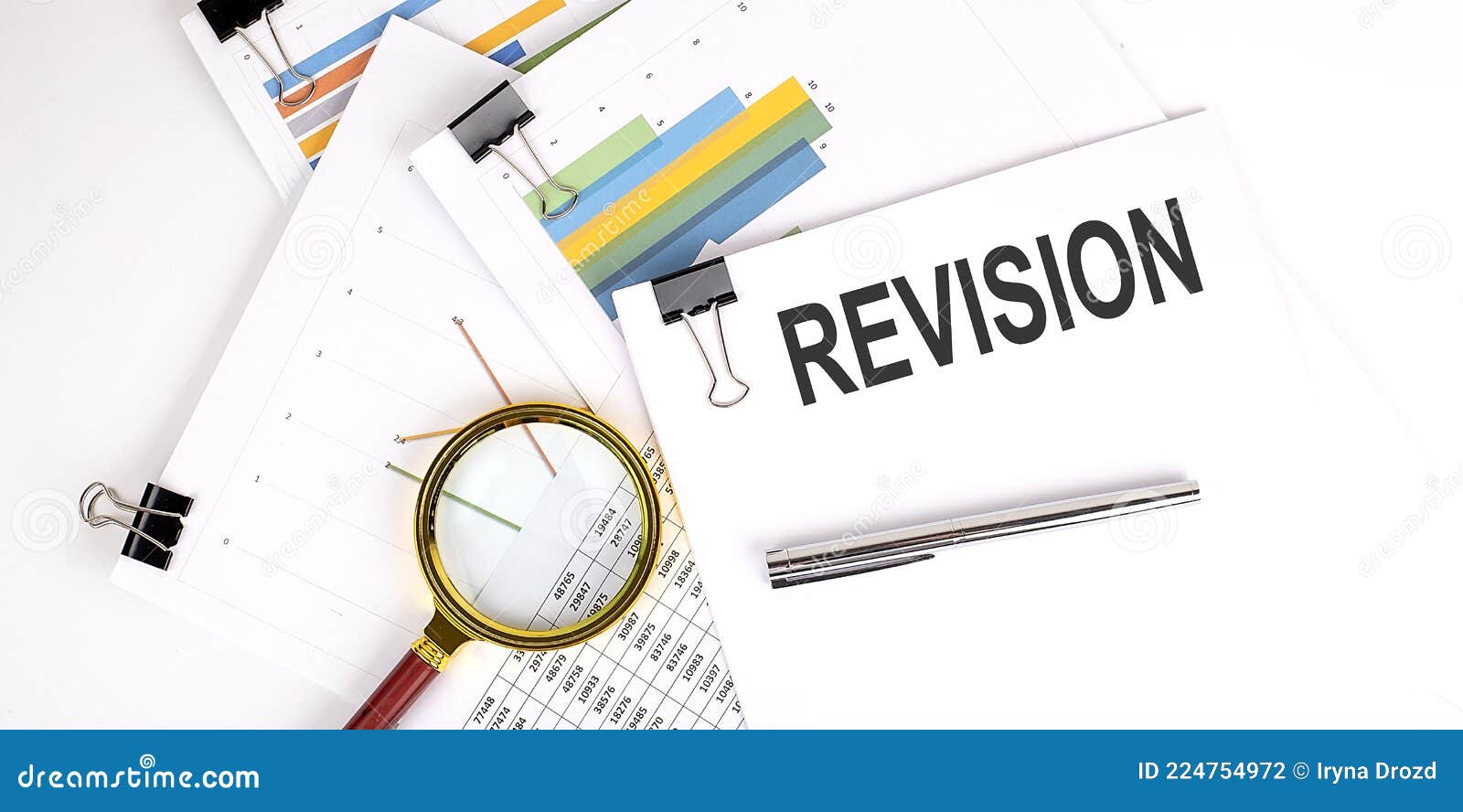REVISION Text On White Paper On The Light Background With Charts Paper ...