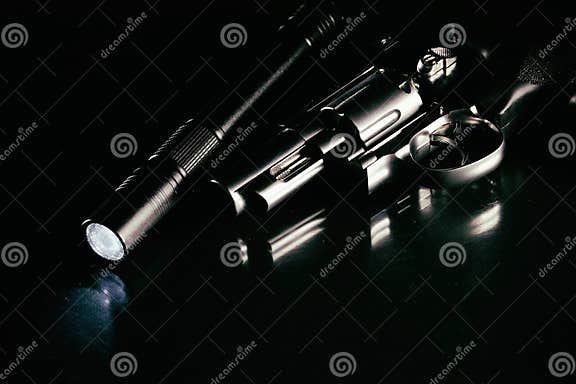 Revolver and Flashlight on a Black Stock Photo - Image of danger ...