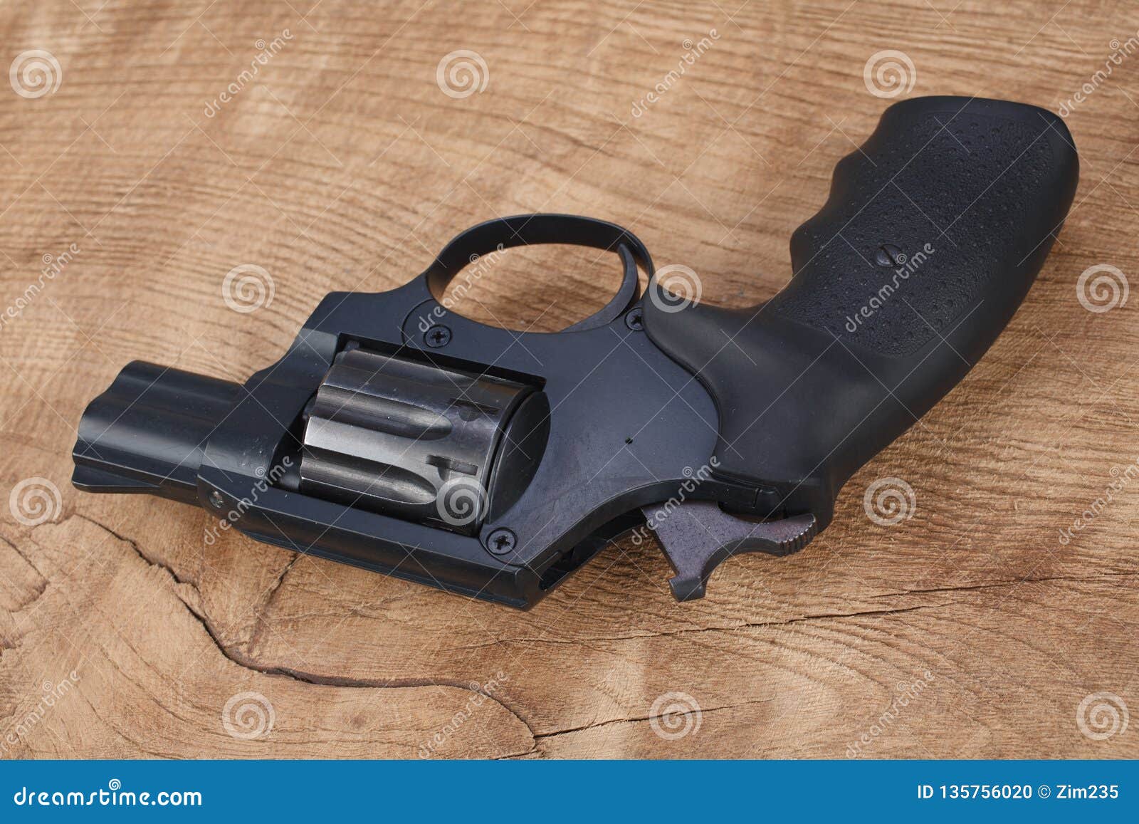 Revolver on the Wooden Table Stock Photo - Image of handgun, ammo ...