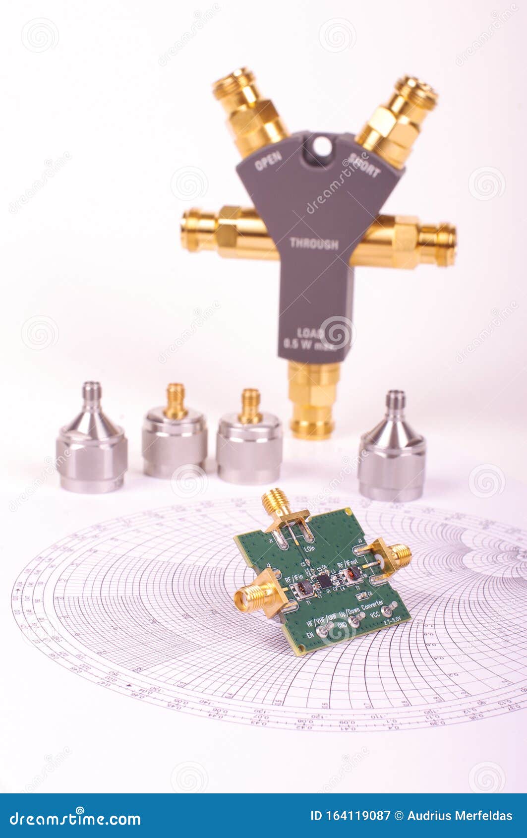 RF Mixer Electronics PCB in Front of Smith Chart and Other Microwave ...