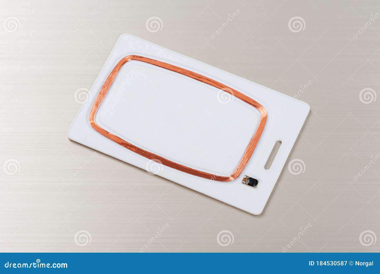 RFID Tag Transponder Under A Magnifying Glass, Next To A Pen And ...