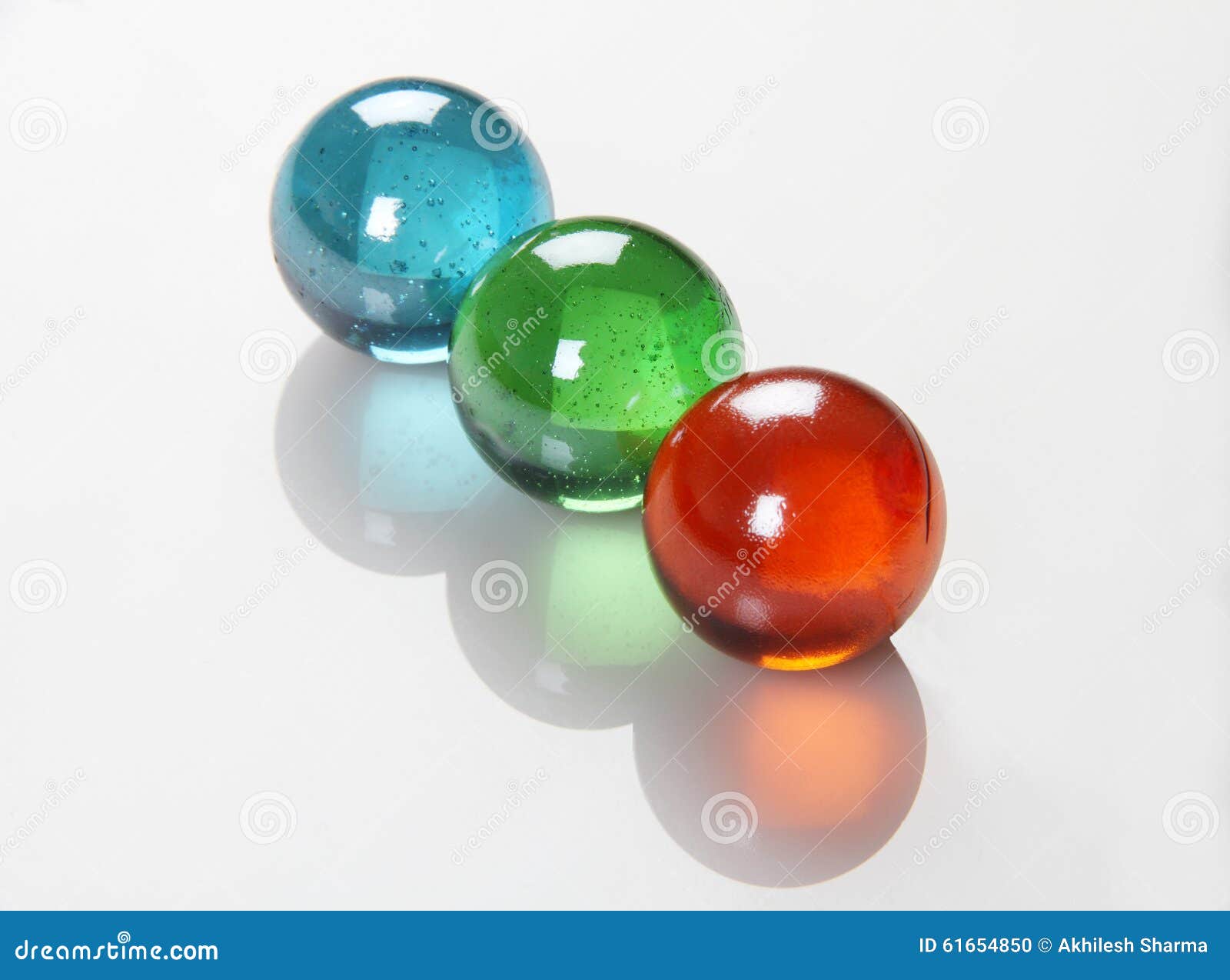 RGB Color Balls / Marbles /Orbs on White Reflective Background Stock ...