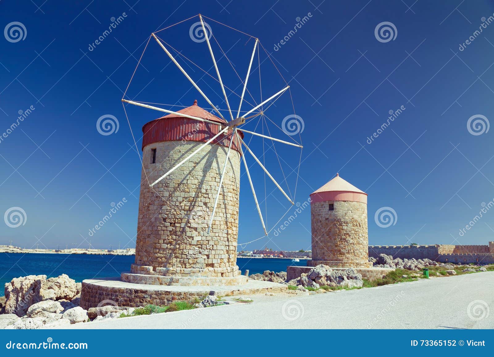 Rhodes windmills stock photo. Image of harbour, summer - 73365152