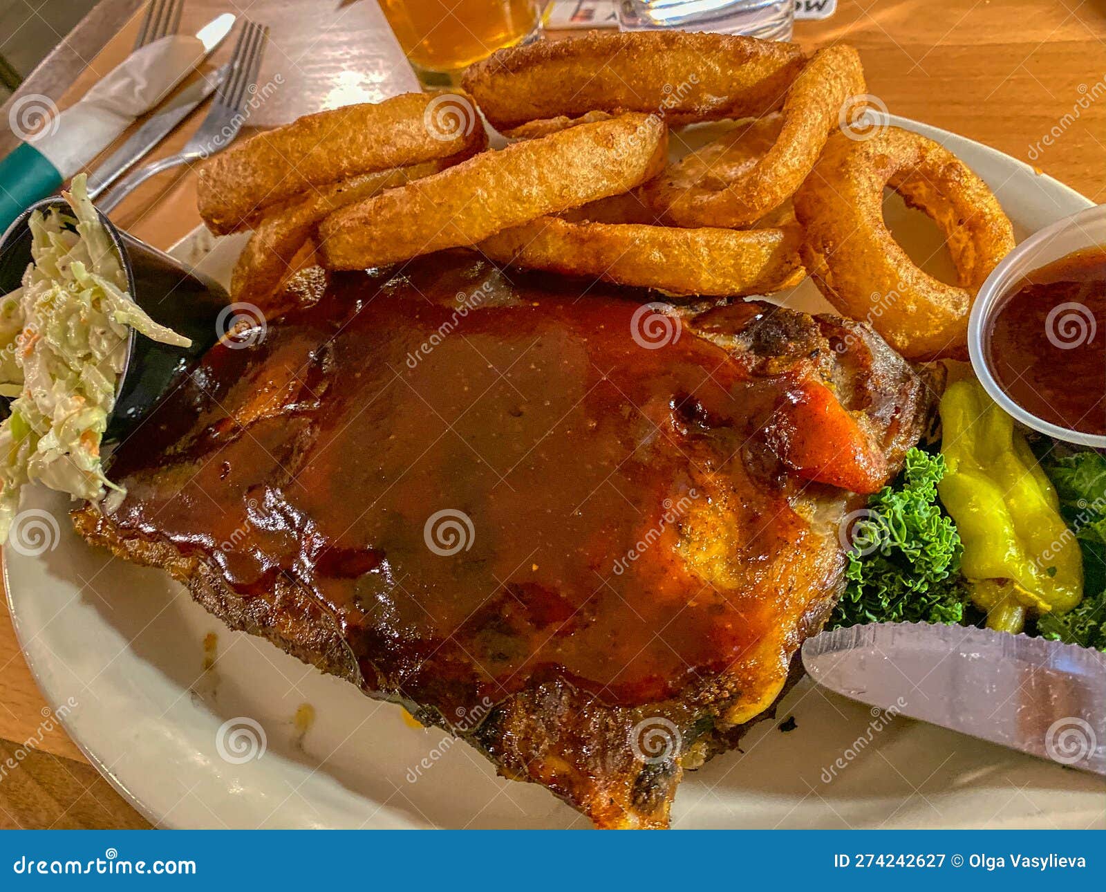 Rib Dinner with Onion Rings, Cole Slaw and Sauce Stock Image - Image of ...