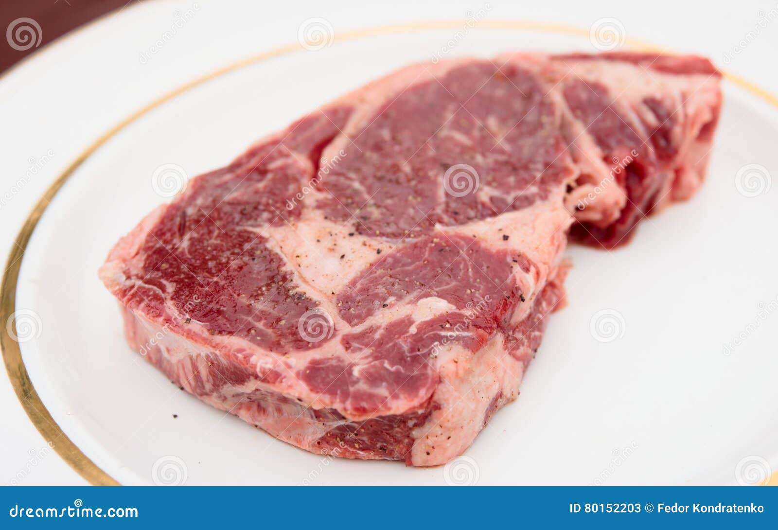 Rib Eye Steak in a Rustic Plate Stock Image - Image of fatty, steak ...