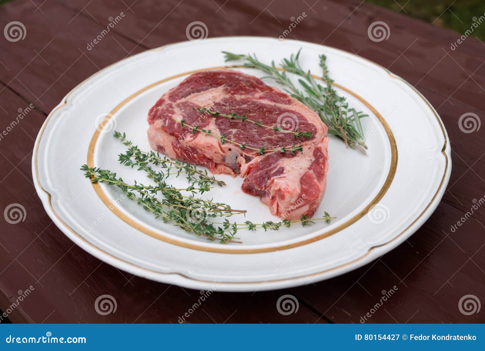 Rib Eye Steak in a Rustic Plate on Wooden Table Stock Image - Image of ...