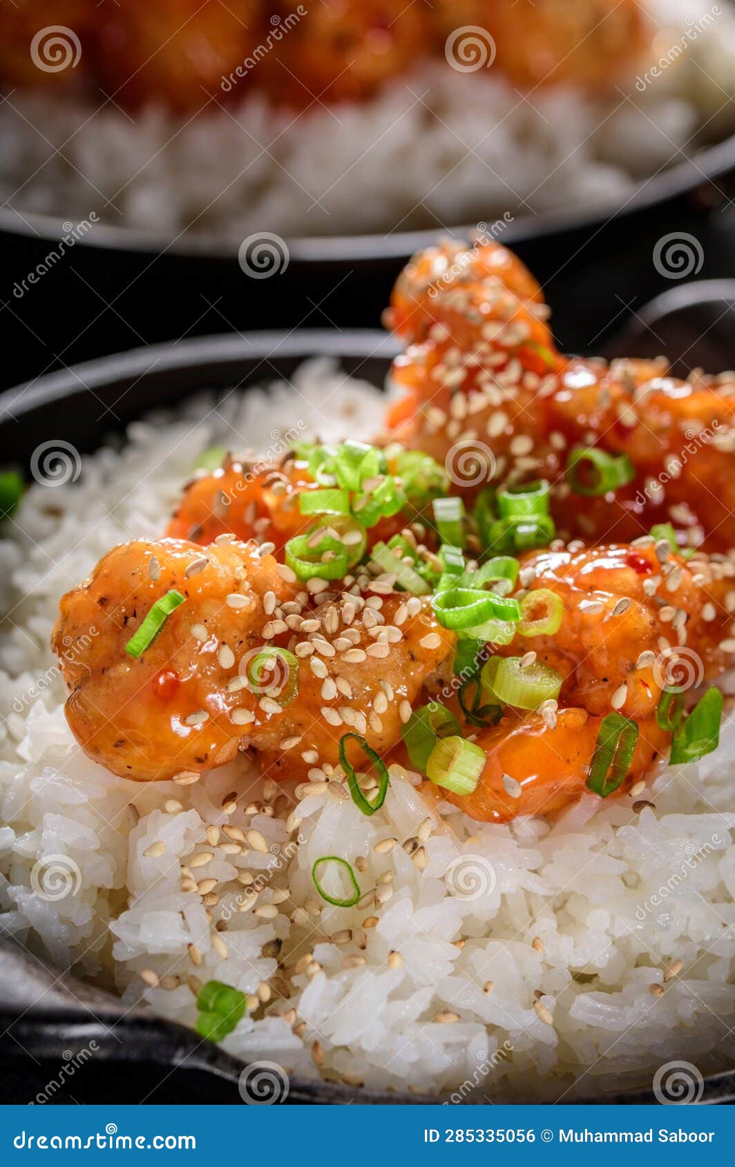 Deep-Fried Orange Chicken Served on a Bed of Steamed White Rice ...