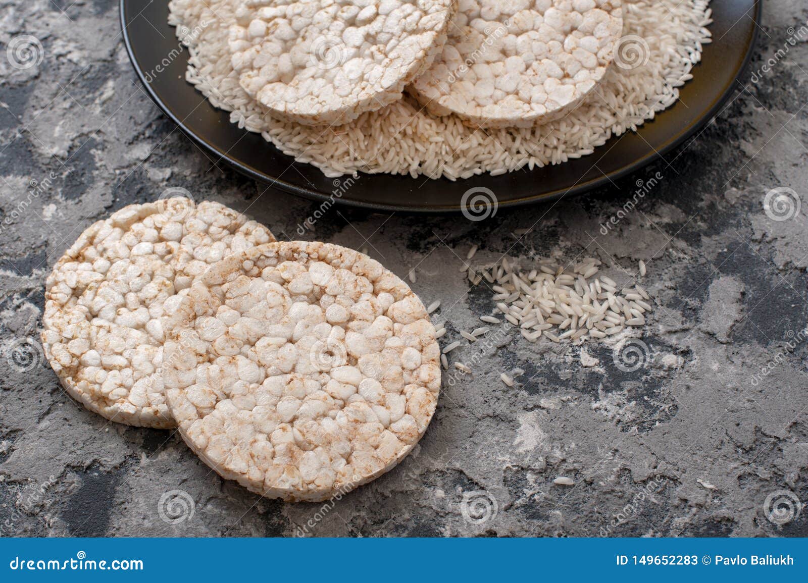 Rice Bread Slices on Black Plate on Textured Background Stock Image ...