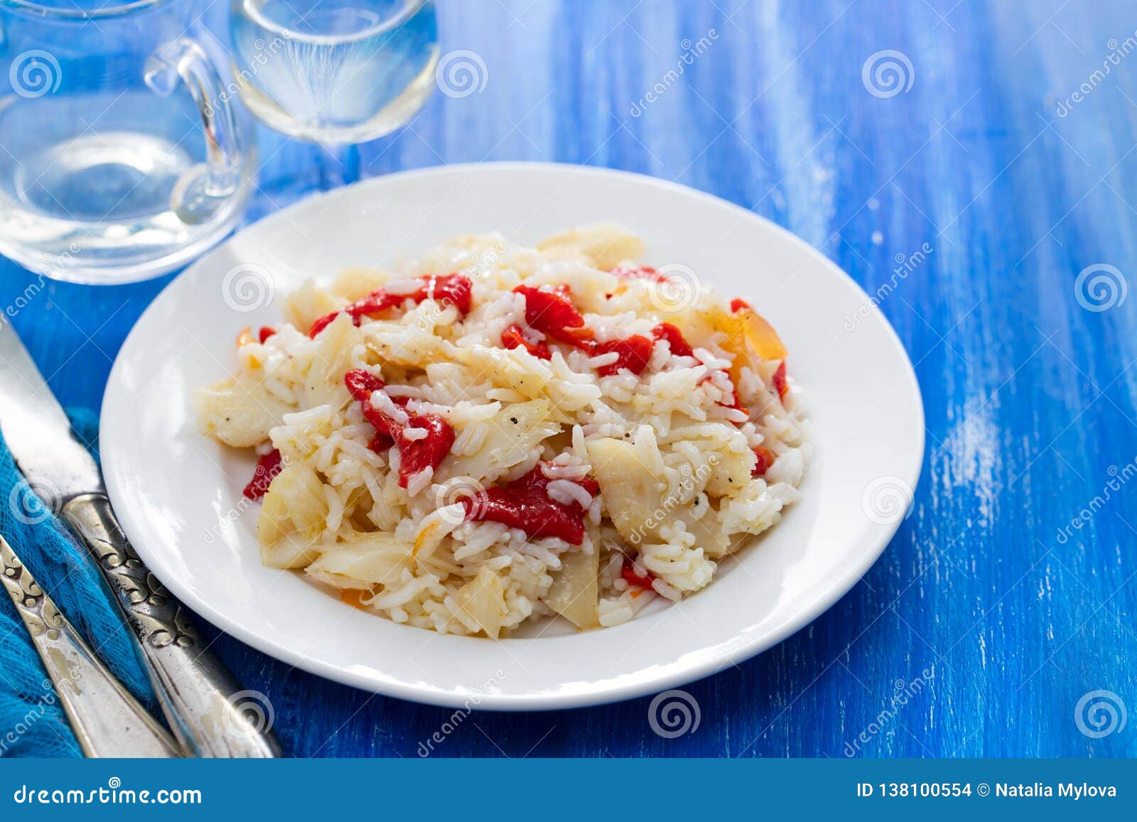 Rice with Cod Fish and Red Pepper on White Dish Stock Photo - Image of ...