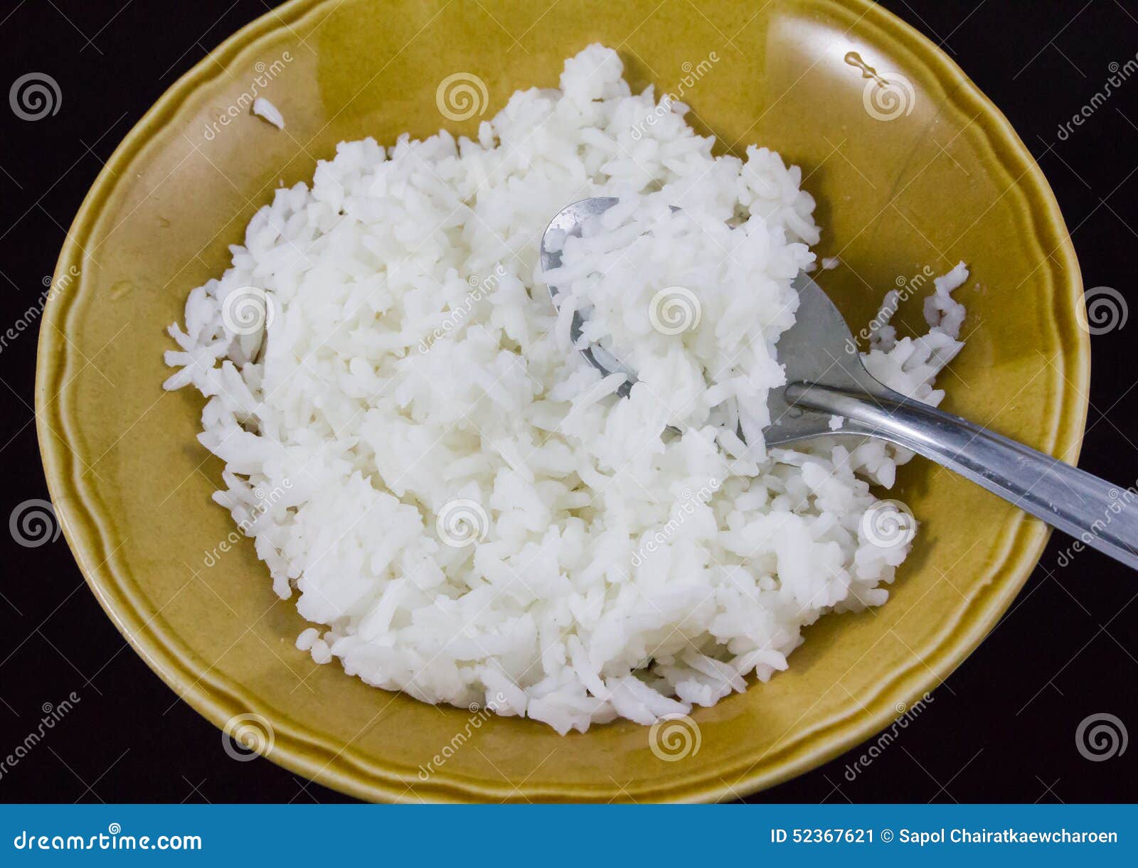 Rice in a dish with spoon stock image. Image of cereal - 52367621