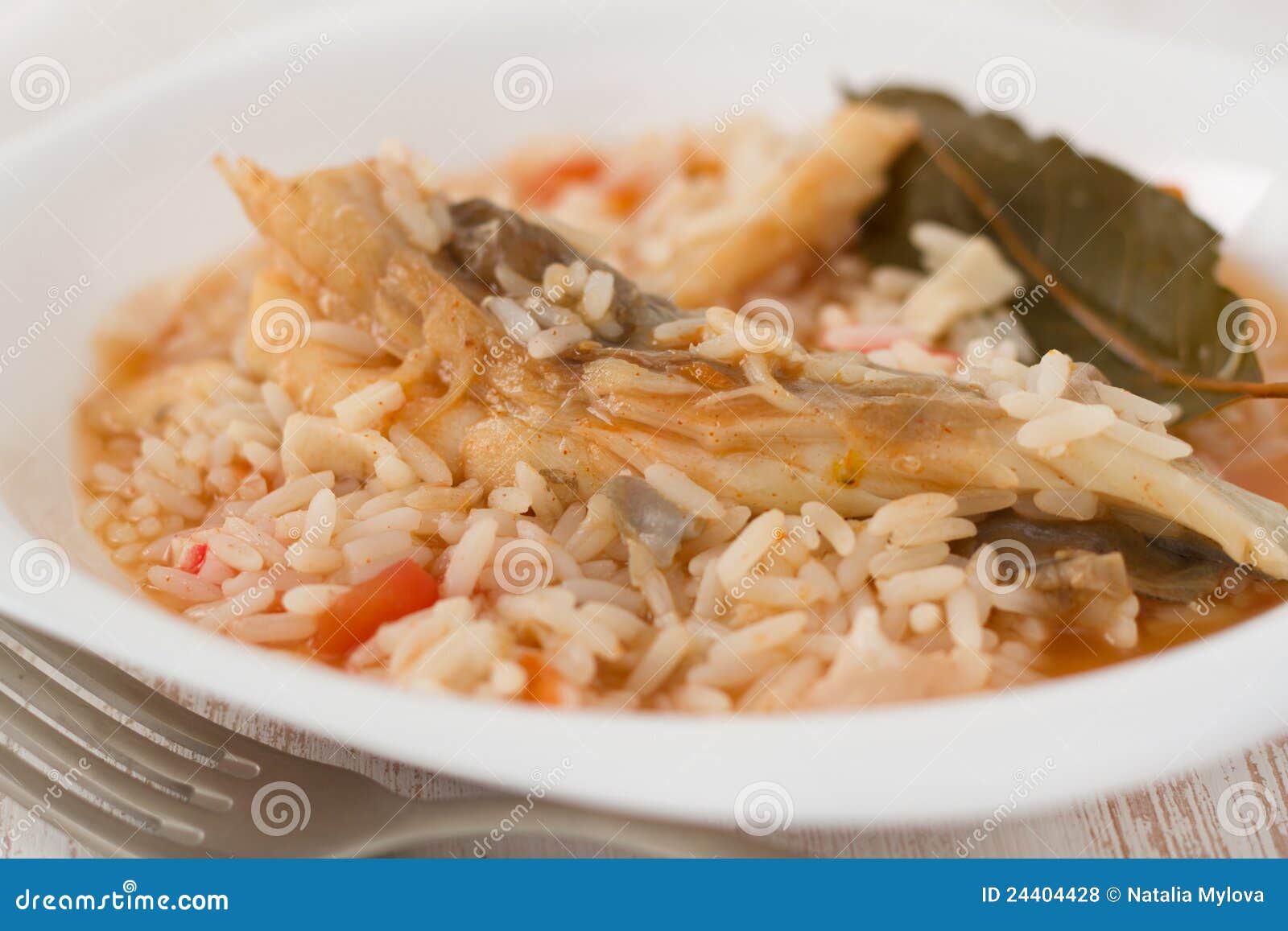 Rice with Fish on the Plate Stock Photo - Image of plate, fork: 24404428