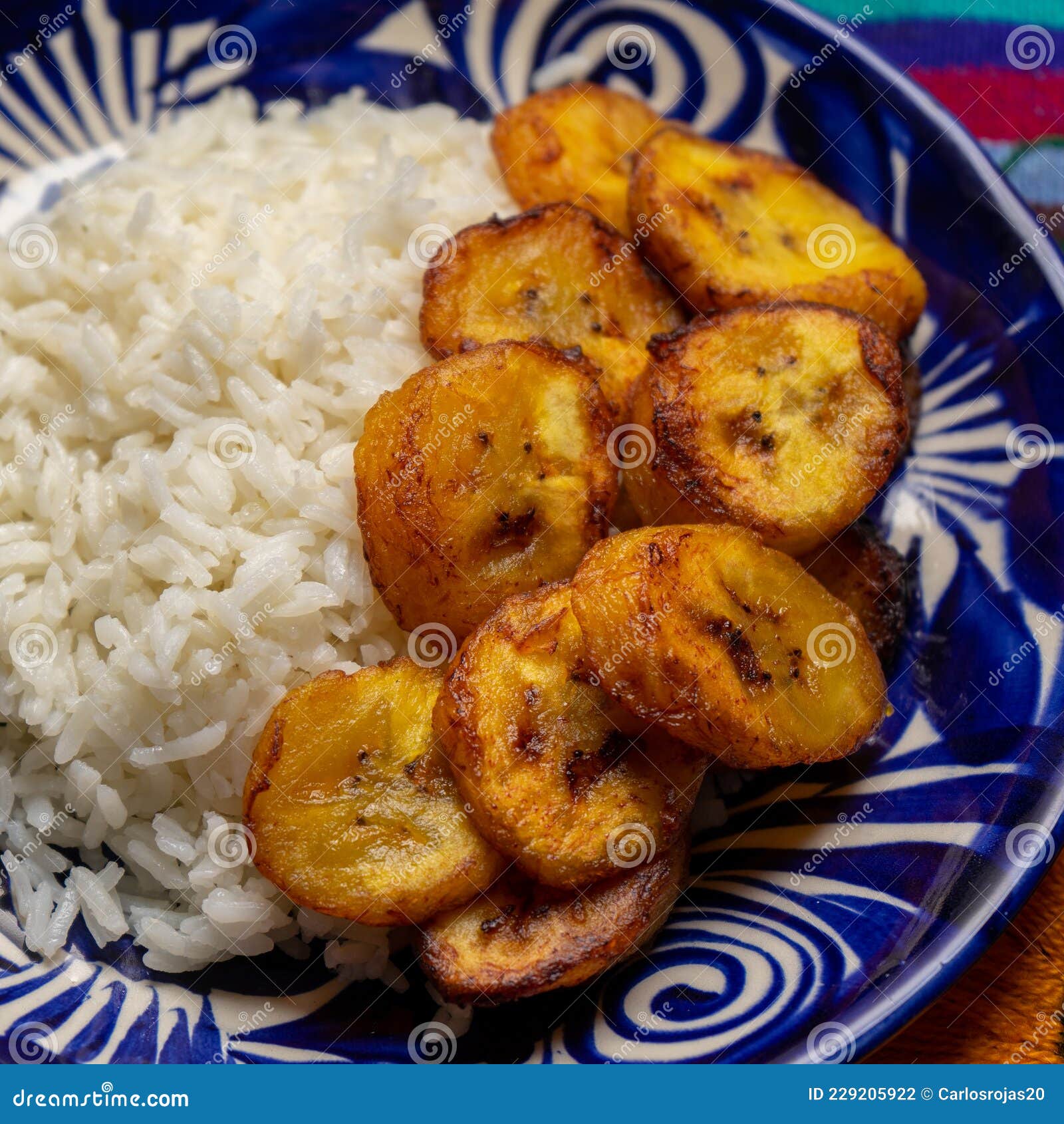 Rice and Fried Banana Also Called Cuban Style on Rustic Background ...