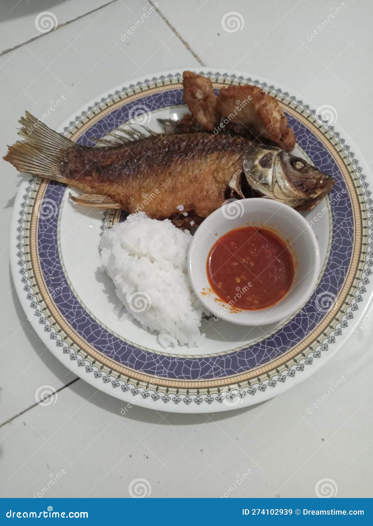 Rice with fried fish stock image. Image of friet, vegetable - 274102939