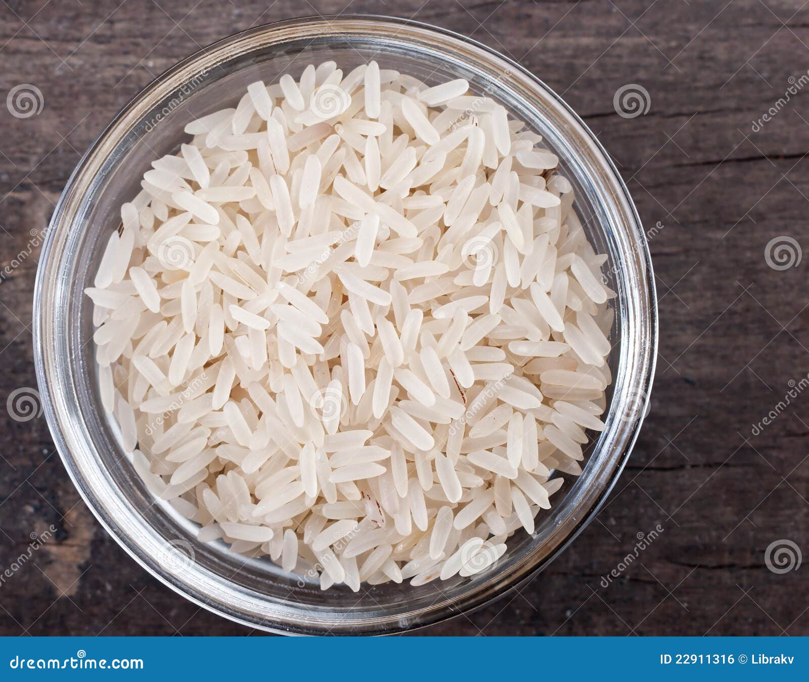 Rice in a glass bowl stock photo. Image of table, bowl - 22911316