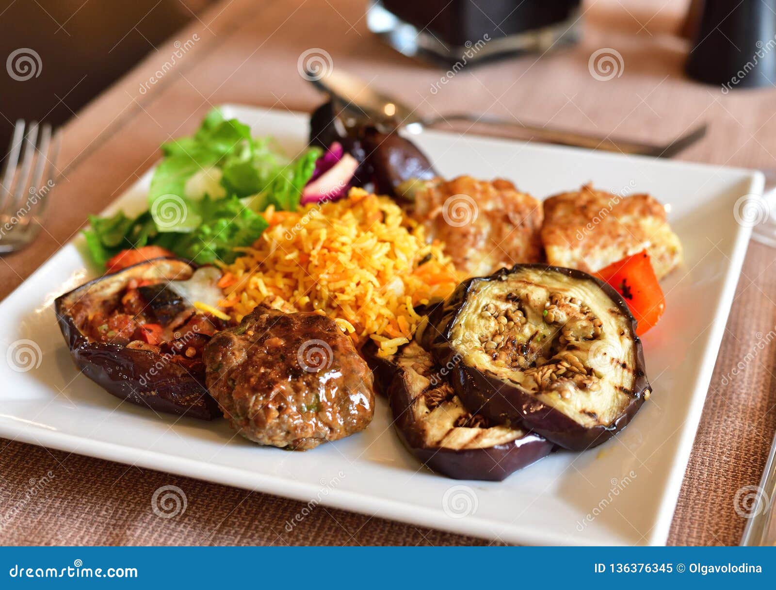 Rice and Grilled Vegetables and Fish on a Plate in Cafe Stock Image ...