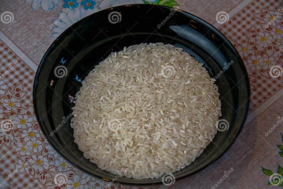 Rice Grits in Raw Form in a Black Plate. Stock Image - Image of fresh ...