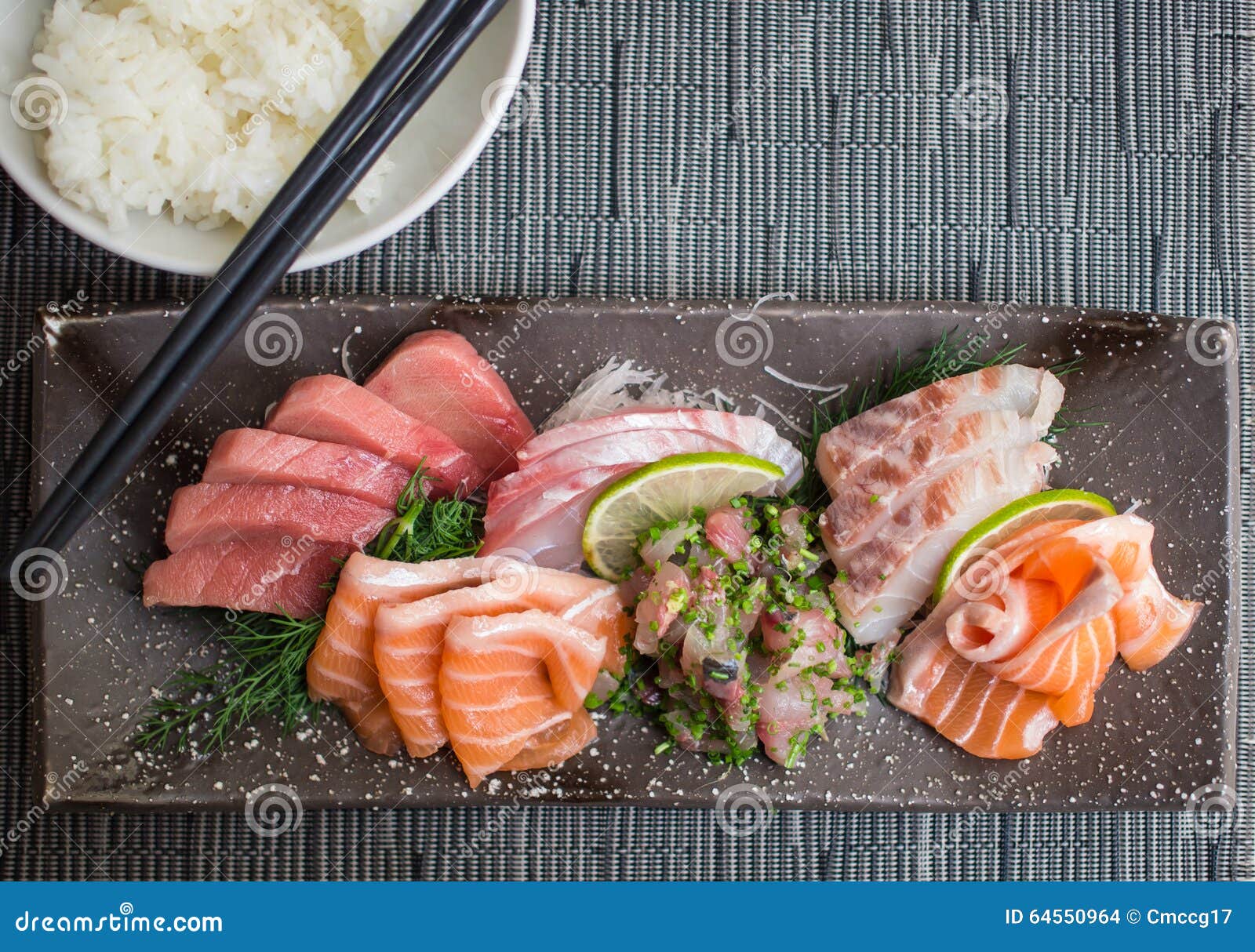 Rice and Japanese Sashimi on a Black Dish Stock Photo - Image of ...