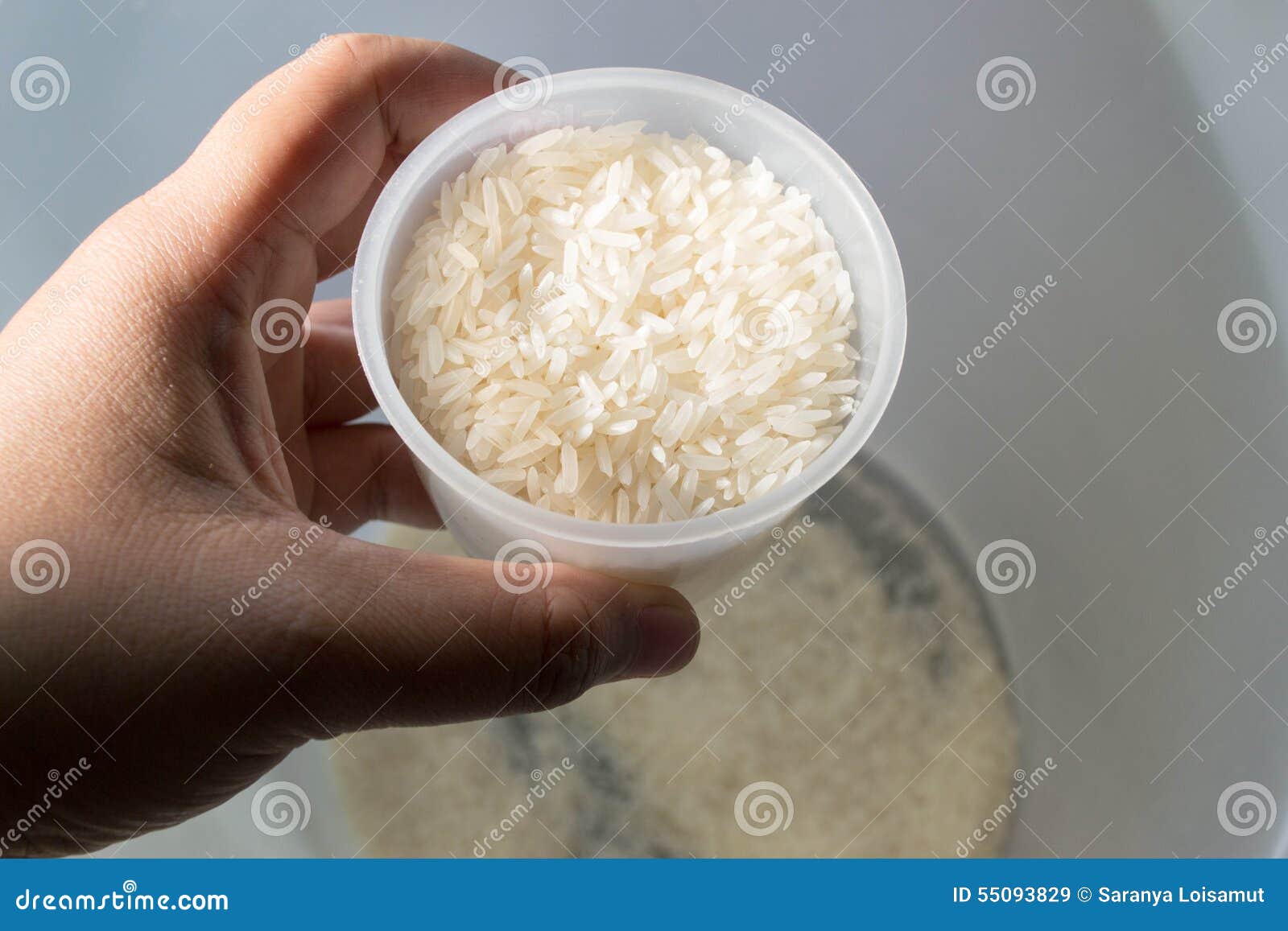 Rice in measuring cup stock image. Image of handful, gentle - 55093829