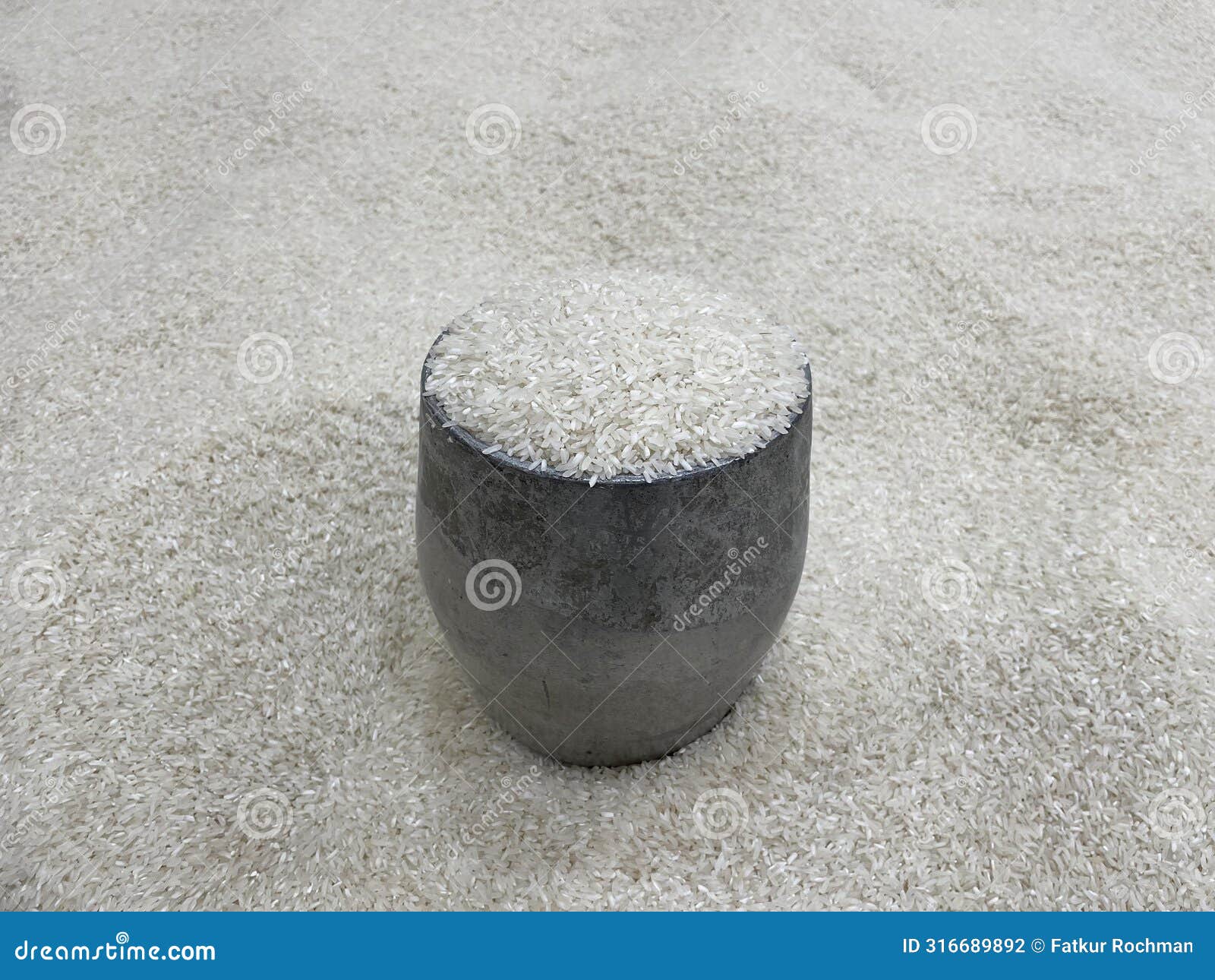 Rice Measuring Tool with a Pile of Rice in the Background Stock Photo ...