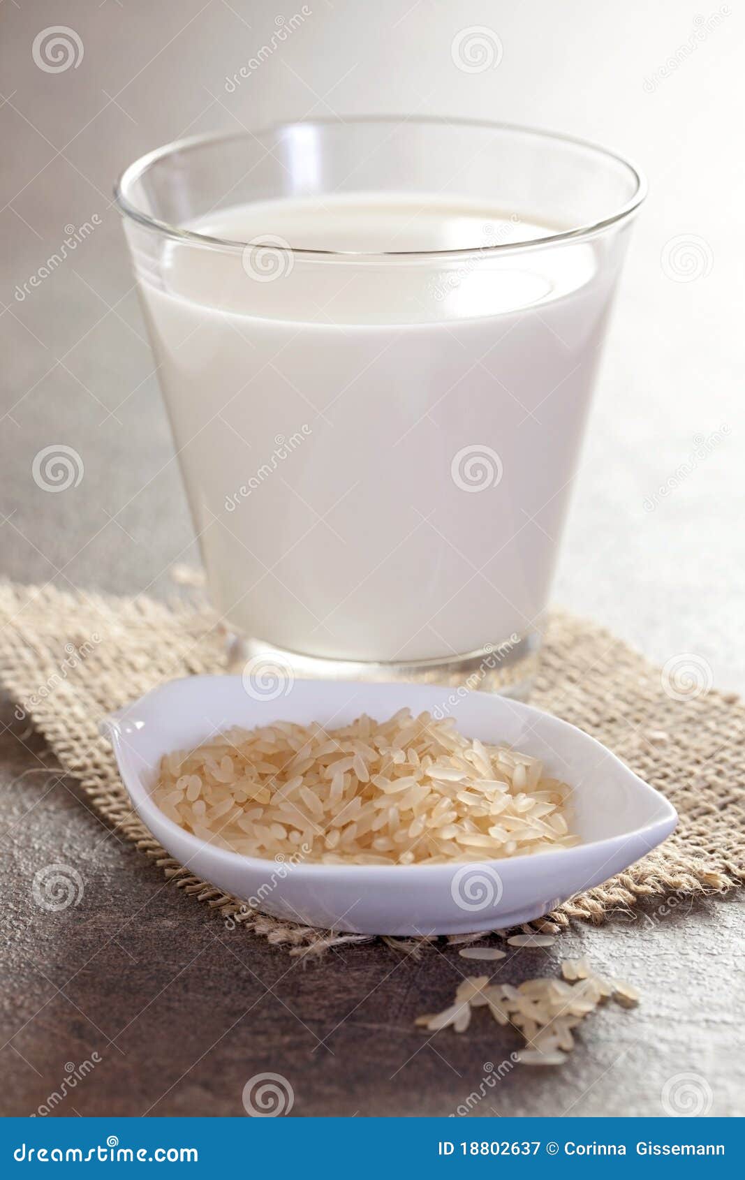 Rice Milk Porridge With Nuts And Raisins In A Blue Dish On A White ...