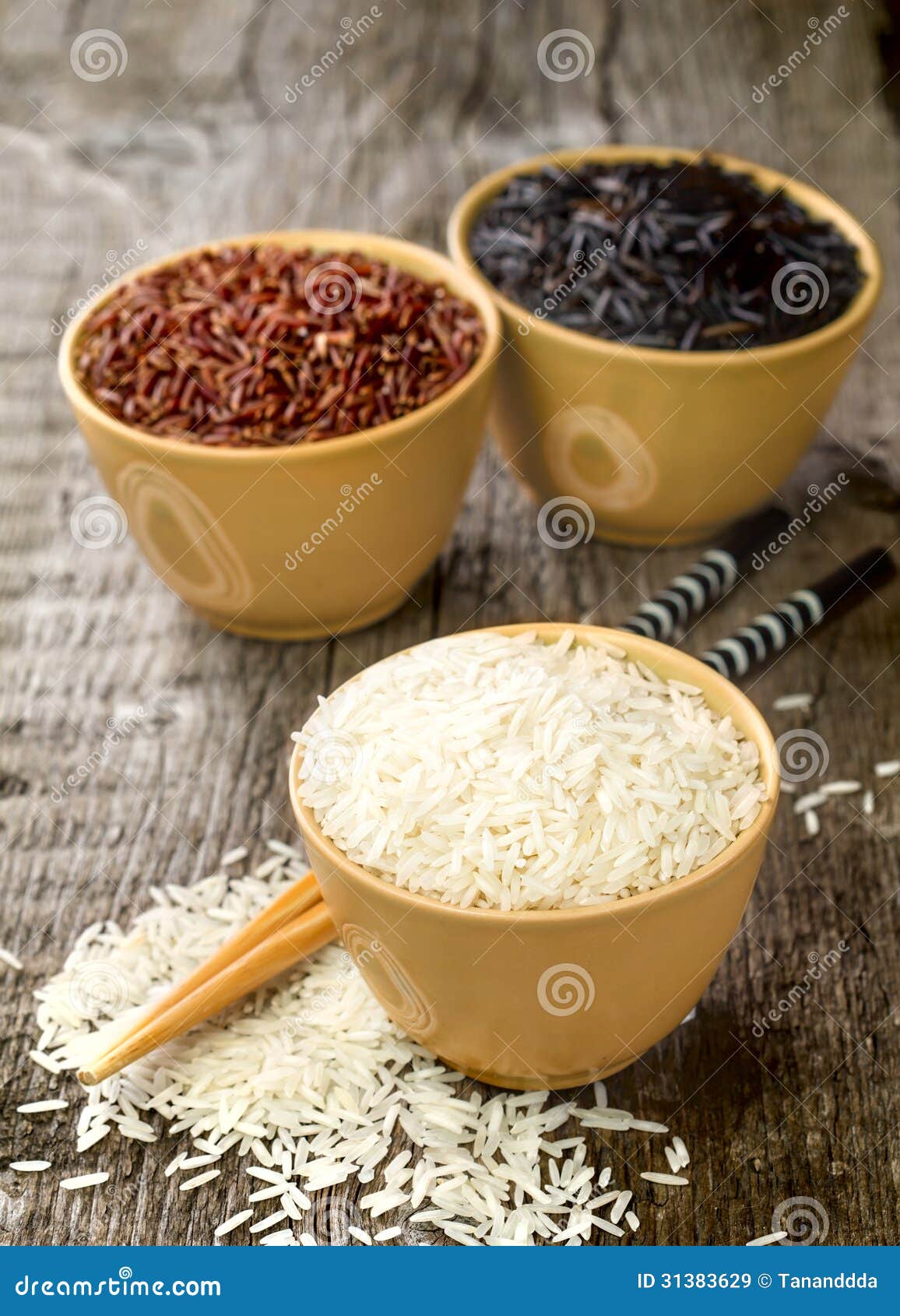 Rice - Red, White and Wild in a Bowls with Chopsticks on Wooden Stock ...