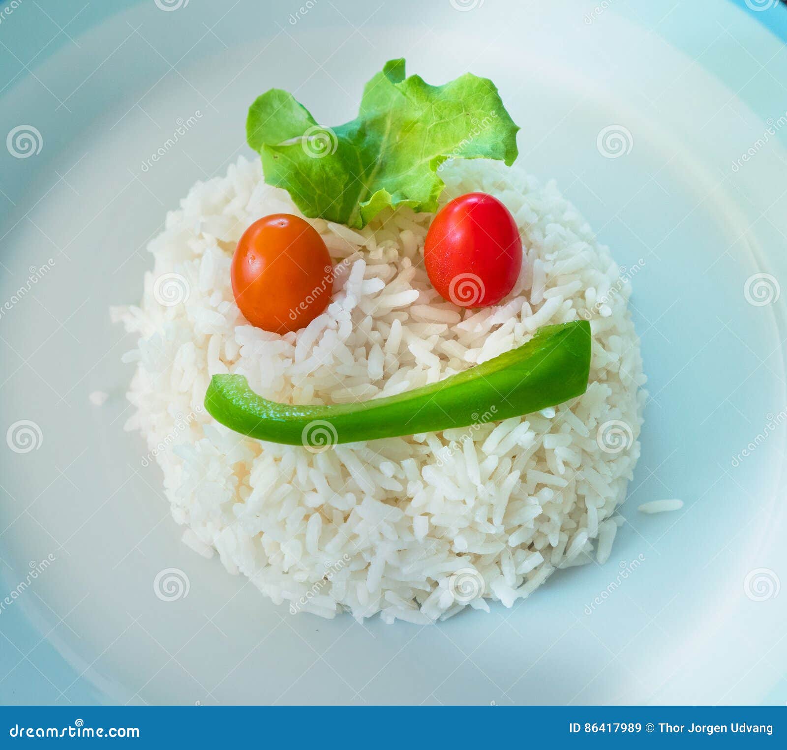Rice shaped as a face stock image. Image of plate, pimiento - 86417989