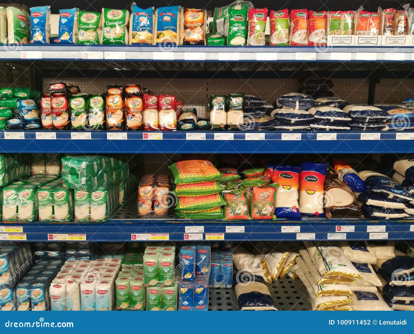 Rice on shelves editorial photography. Image of pack - 100911452