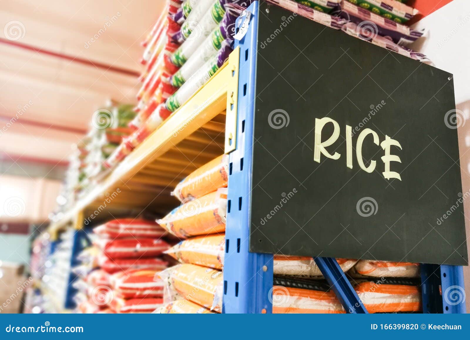Rice Signage with Stacks of Rice on Shelf of Supermarket Stock Photo ...