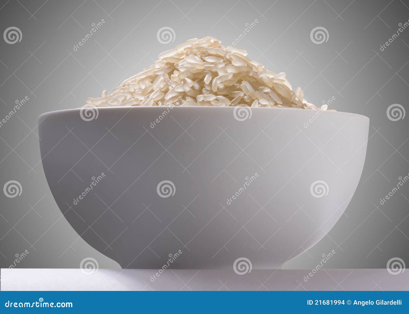 Rice in a white bowl stock photo. Image of rice, bowl - 21681994