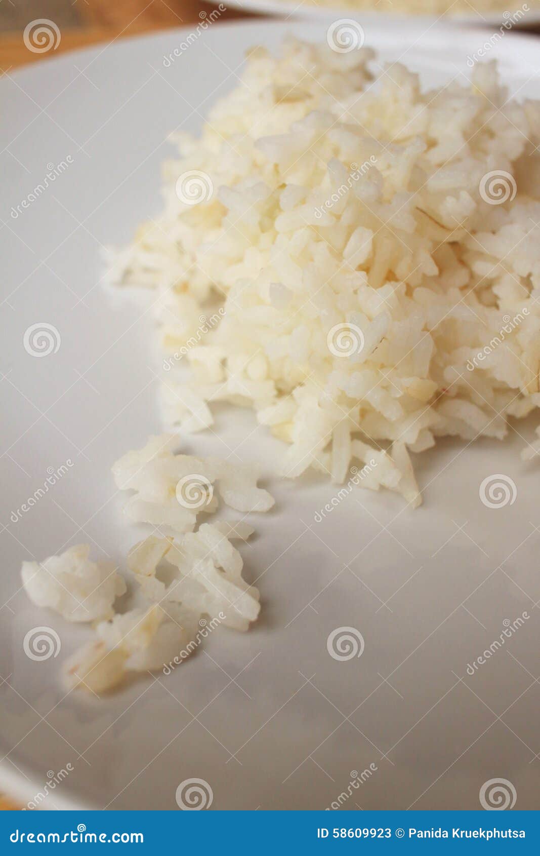 Rice on White Plate on Wooden Background. Stock Image - Image of brown ...