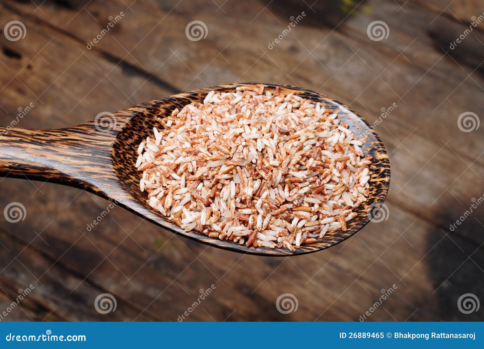 Rice in wooden spoon stock image. Image of table, food - 26889465